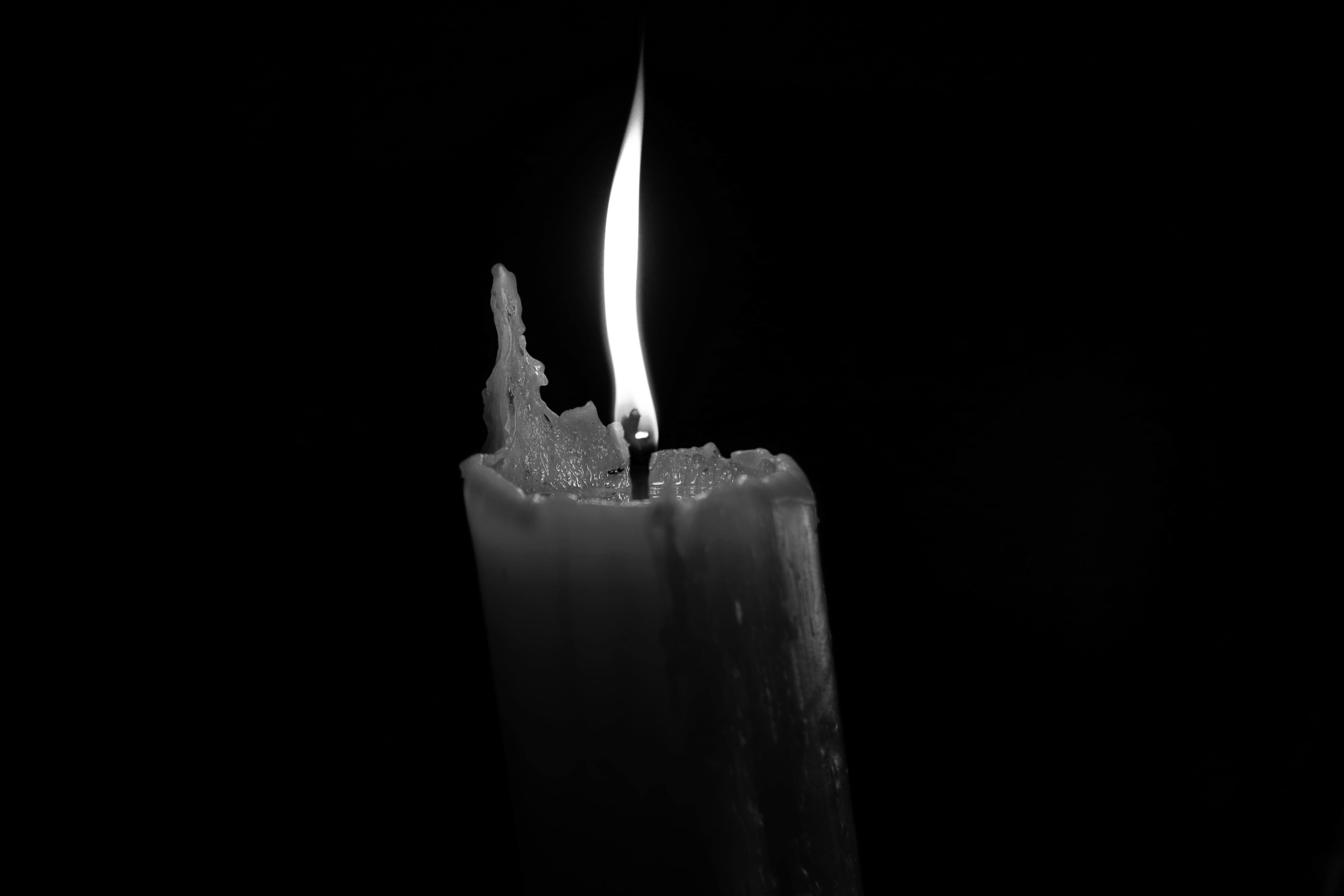 A Grayscale of a Lit Candle · Free Stock Photo