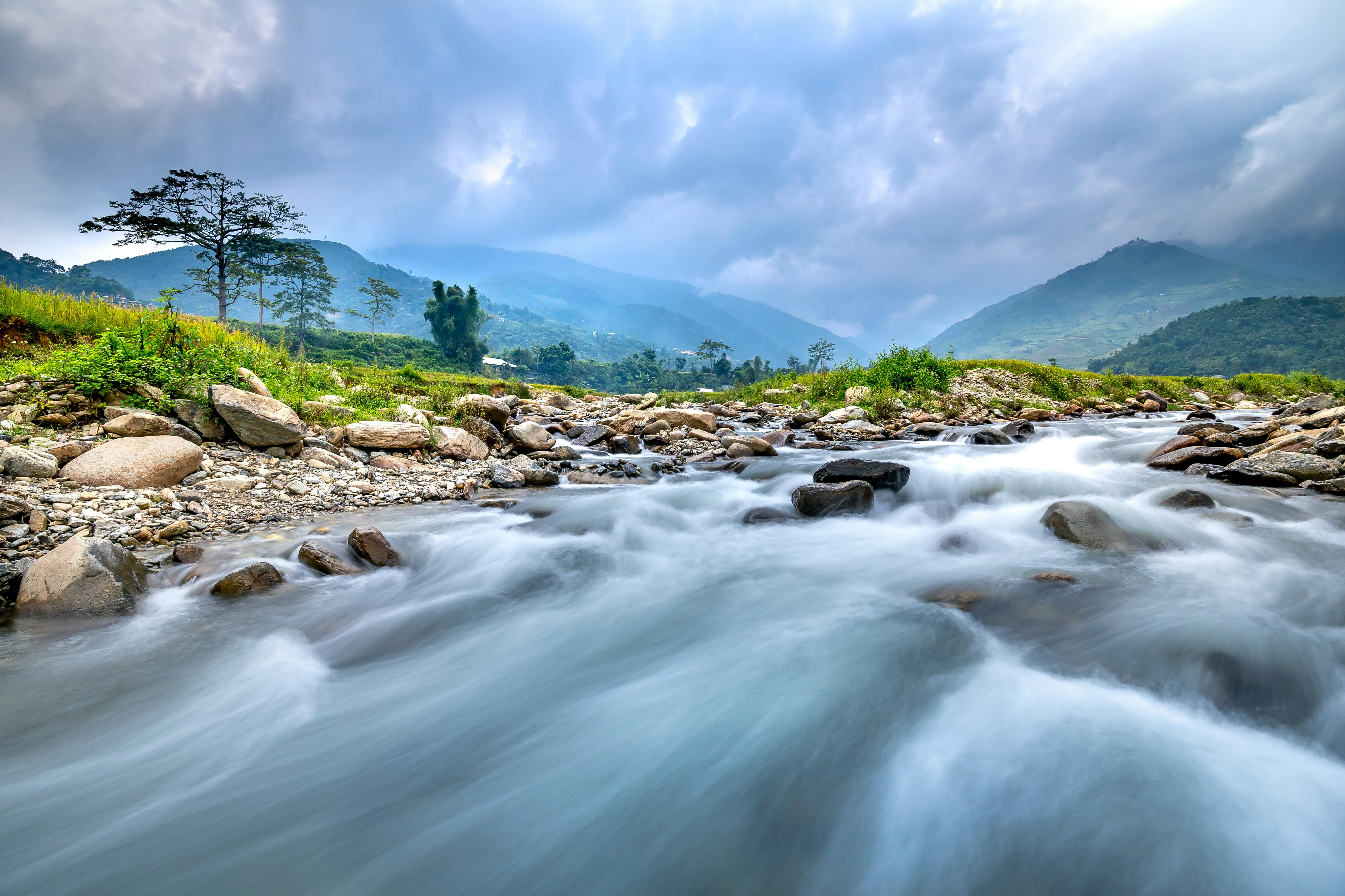 Mountain River Flowing in Green Nature Landscape · Free Stock Photo