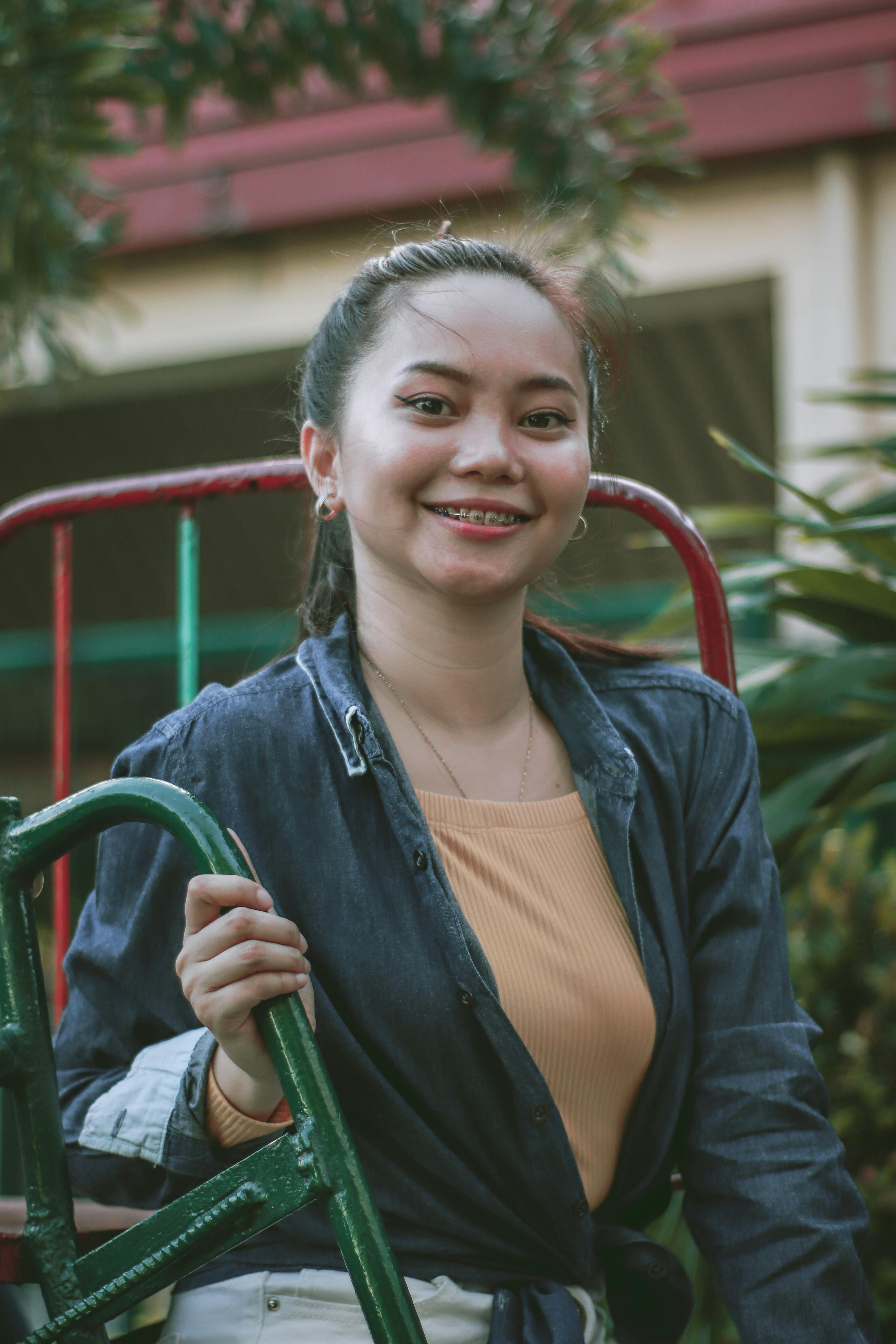 A Person Posing while Smiling · Free Stock Photo