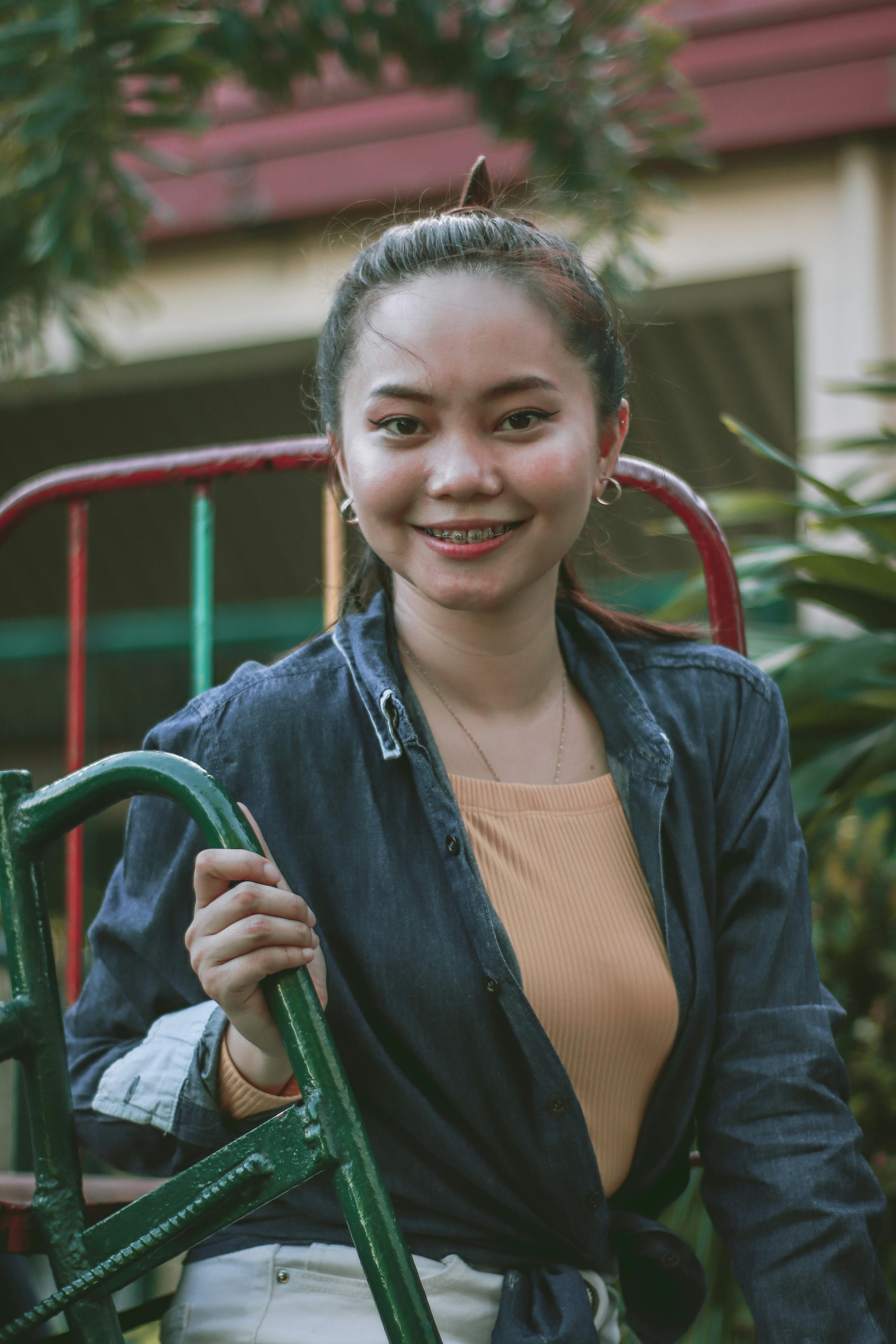 A Woman Posing while Smiling · Free Stock Photo