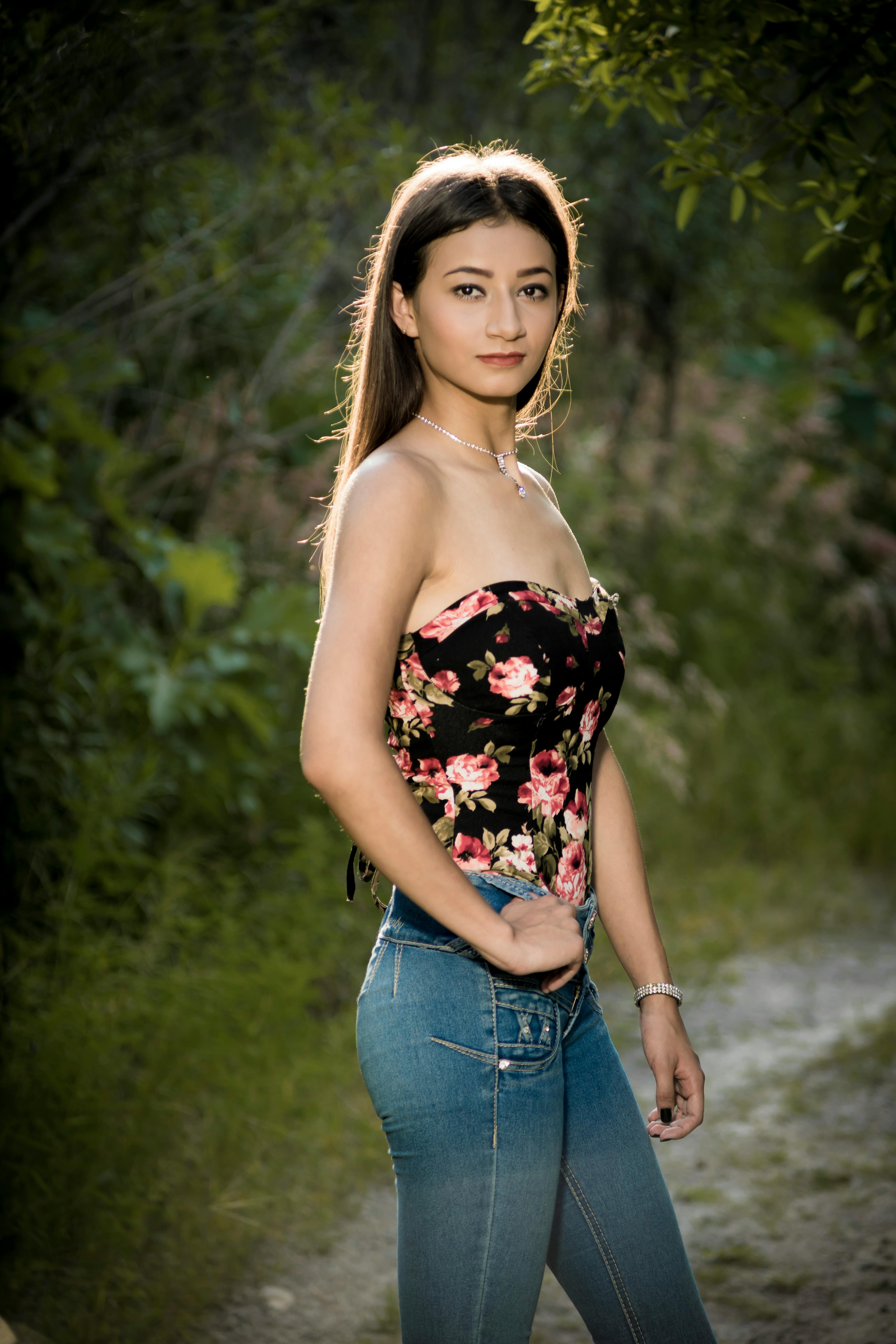Shirtless woman standing against light background in studio · Free ...