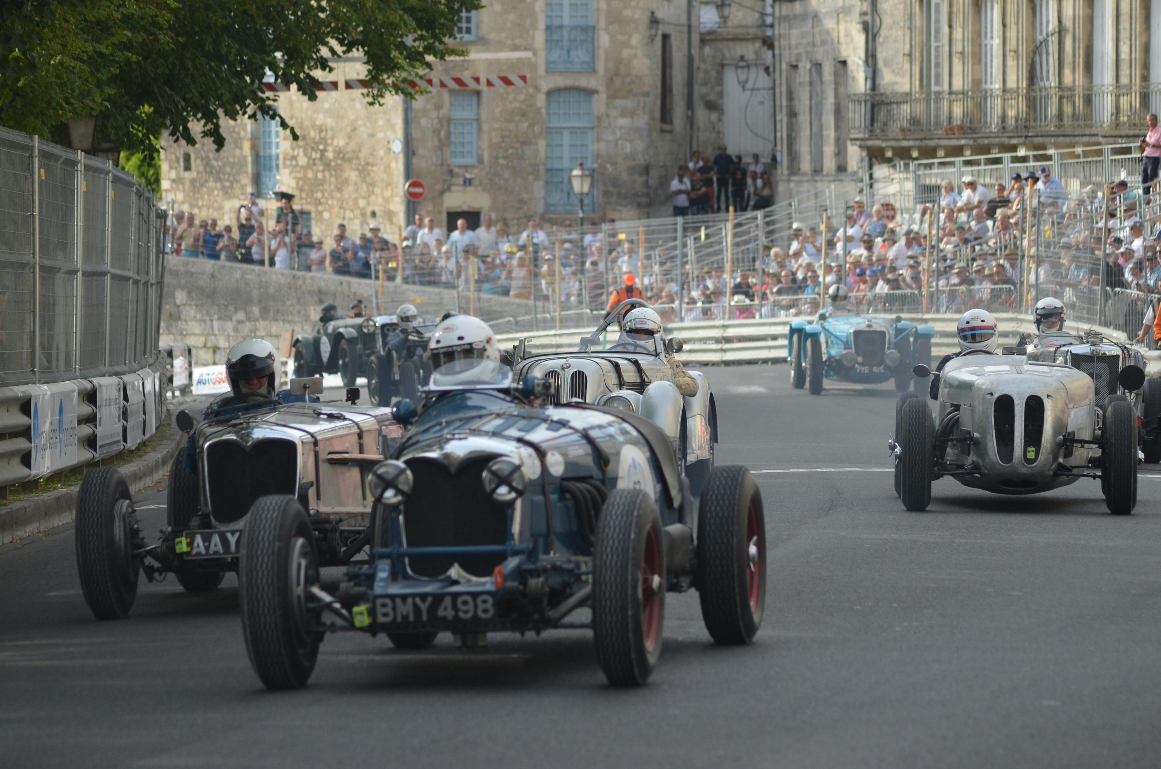 Racers in a Classic Car Racing · Free Stock Photo