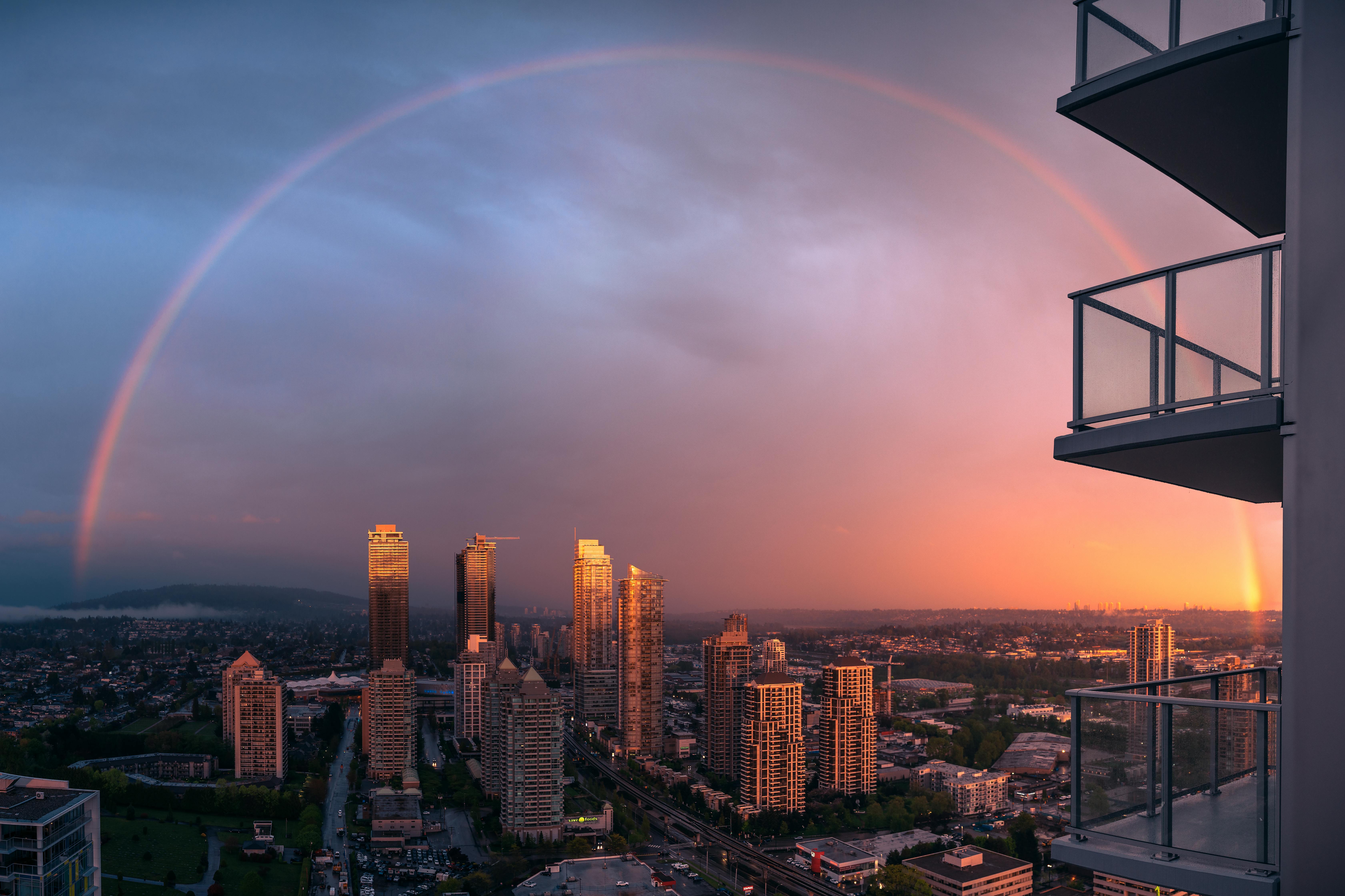 Rainbow Over High-Rise Buildings · Free Stock Photo