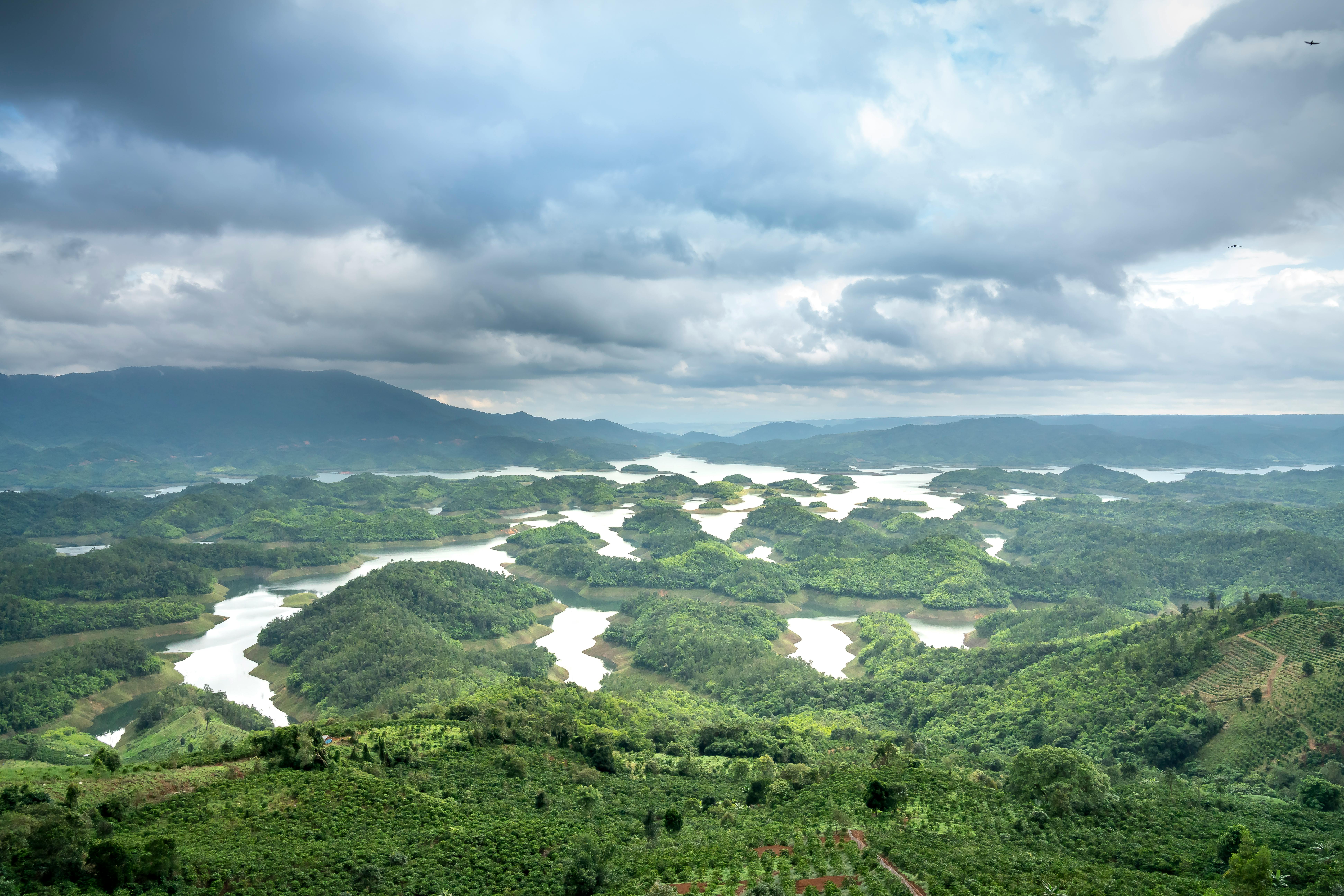 Hilly area with curvy river · Free Stock Photo