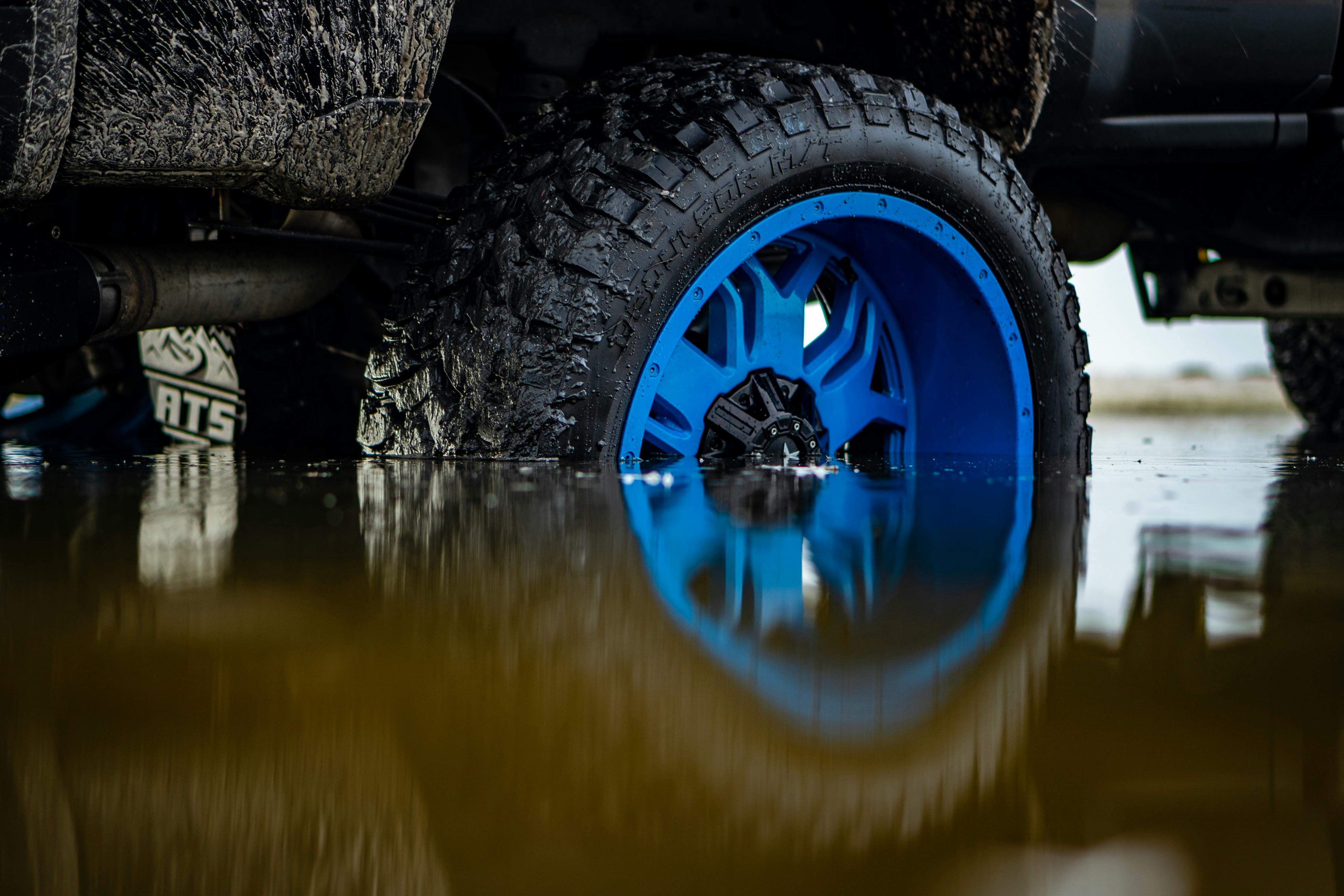 Photograph of a Car Wheel on Water · Free Stock Photo