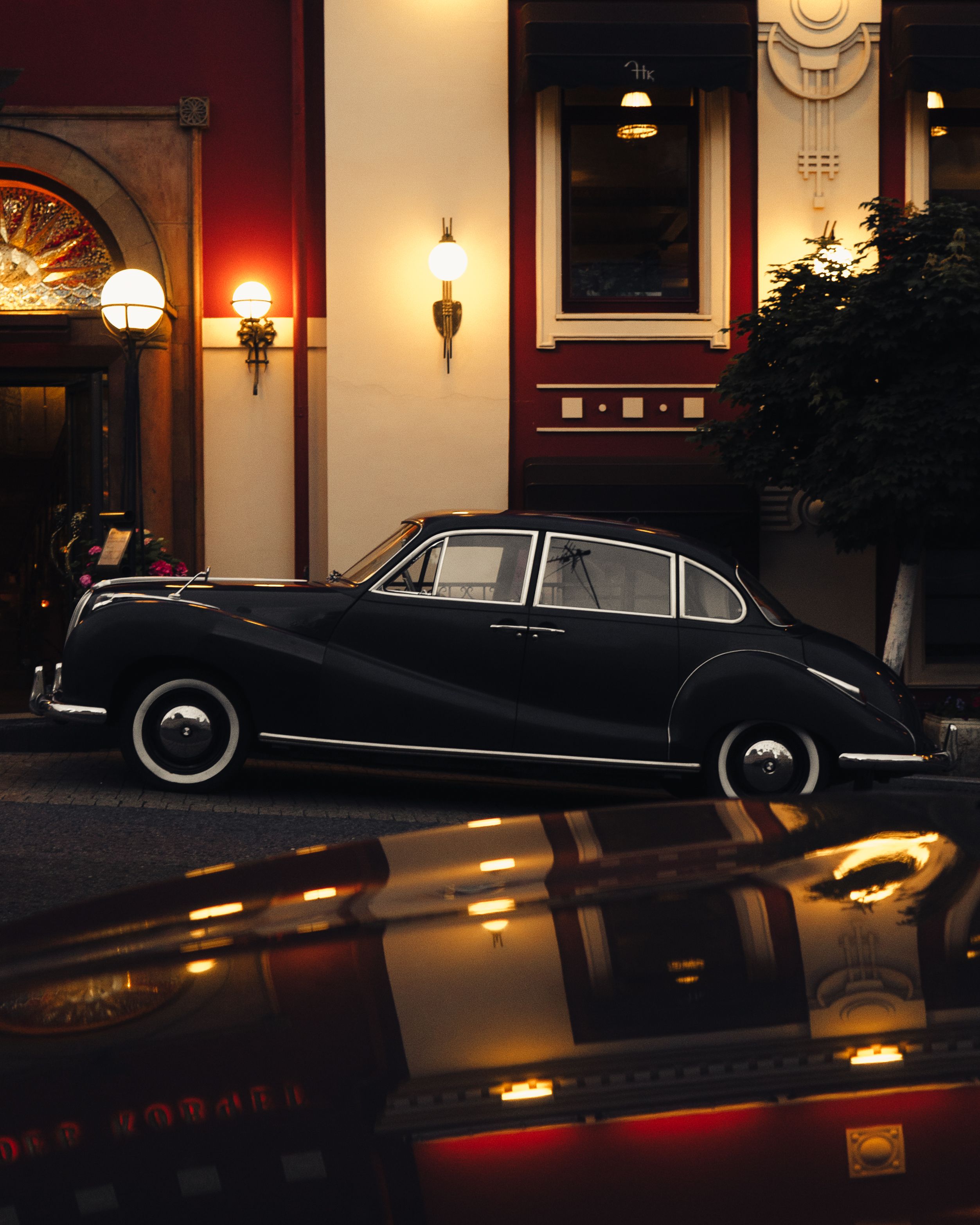 Luxury retro cars parked outside classy building in evening · Free ...