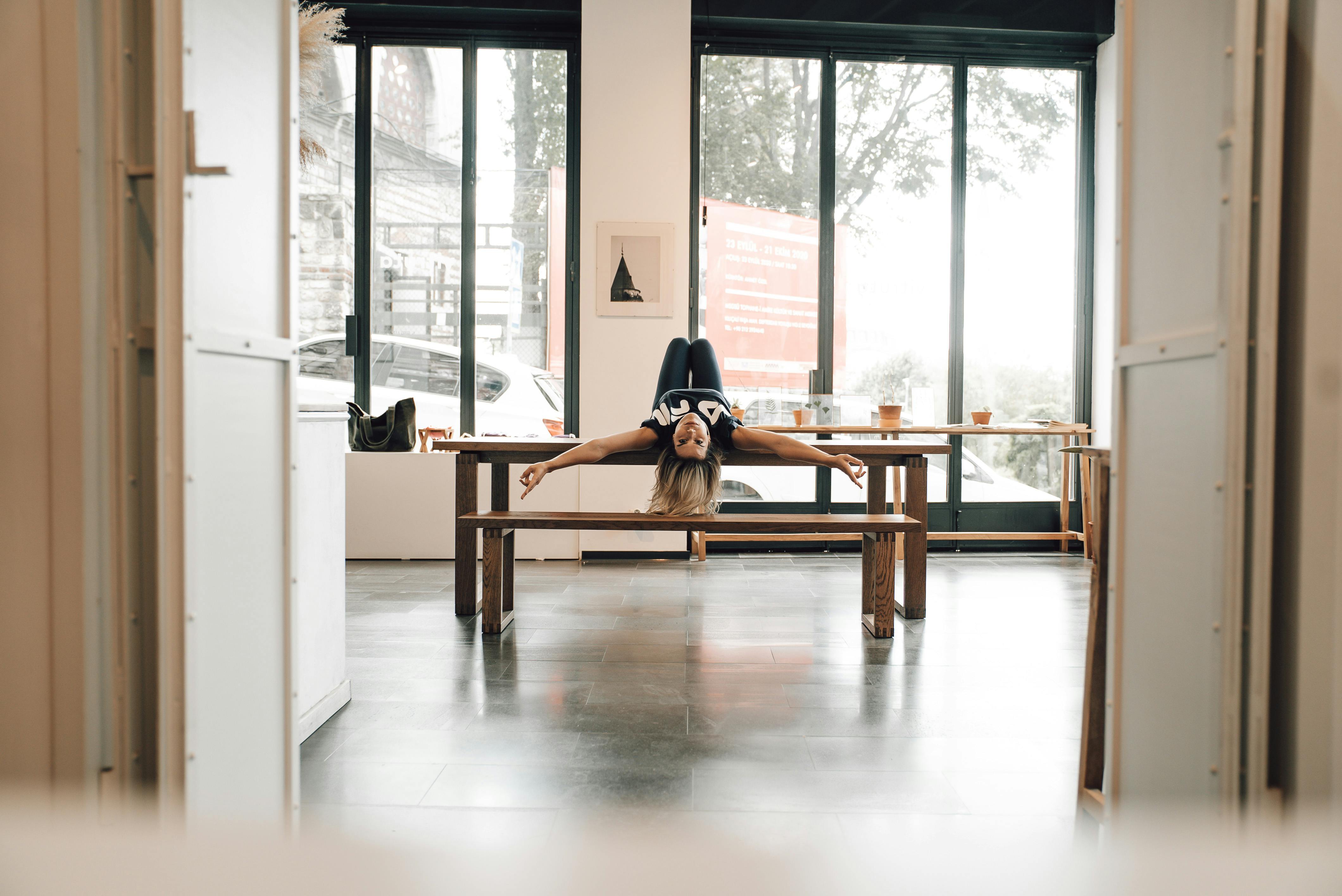 Relaxed woman lying on table in building · Free Stock Photo