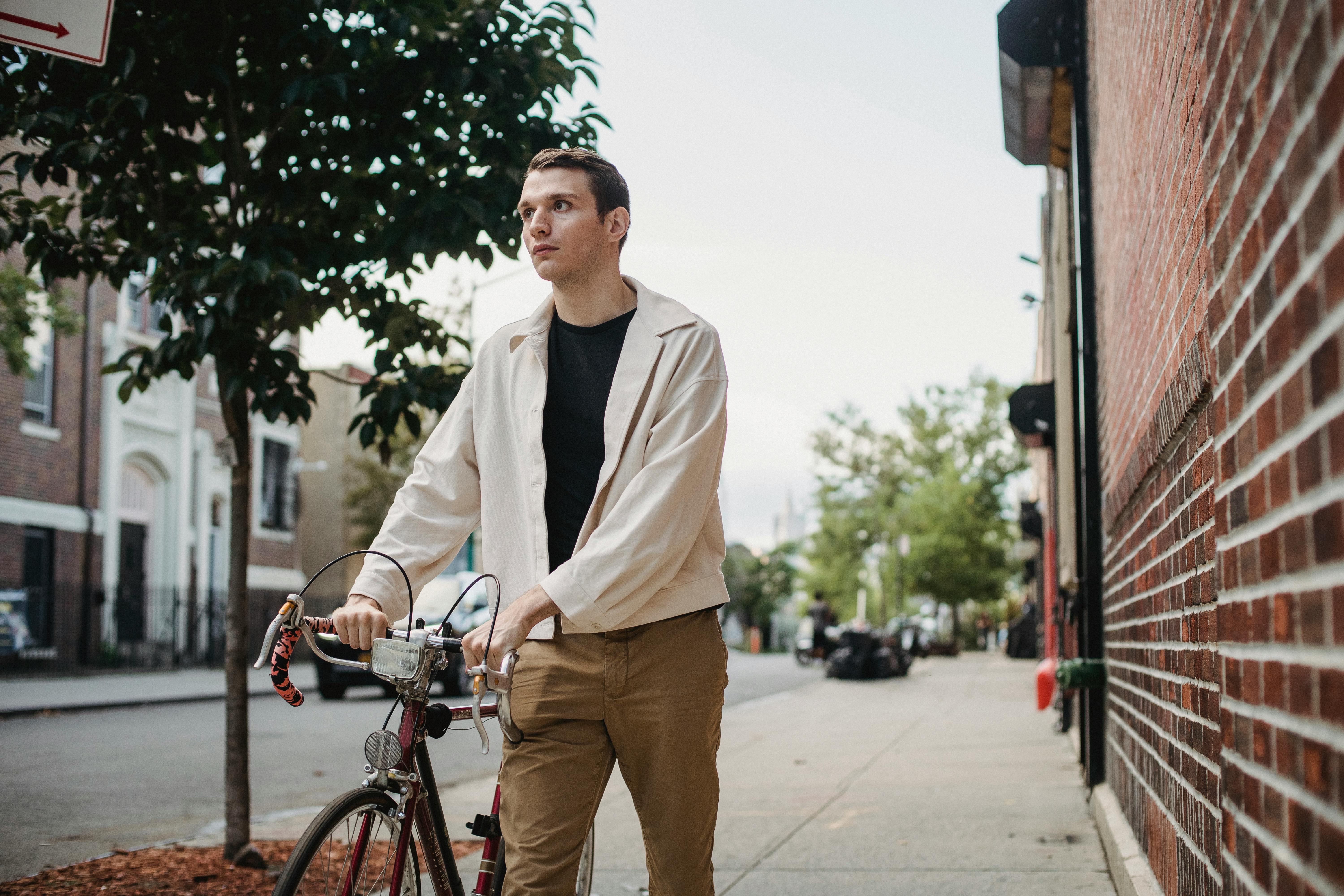 Elegant man walking on street in city district · Free Stock Photo