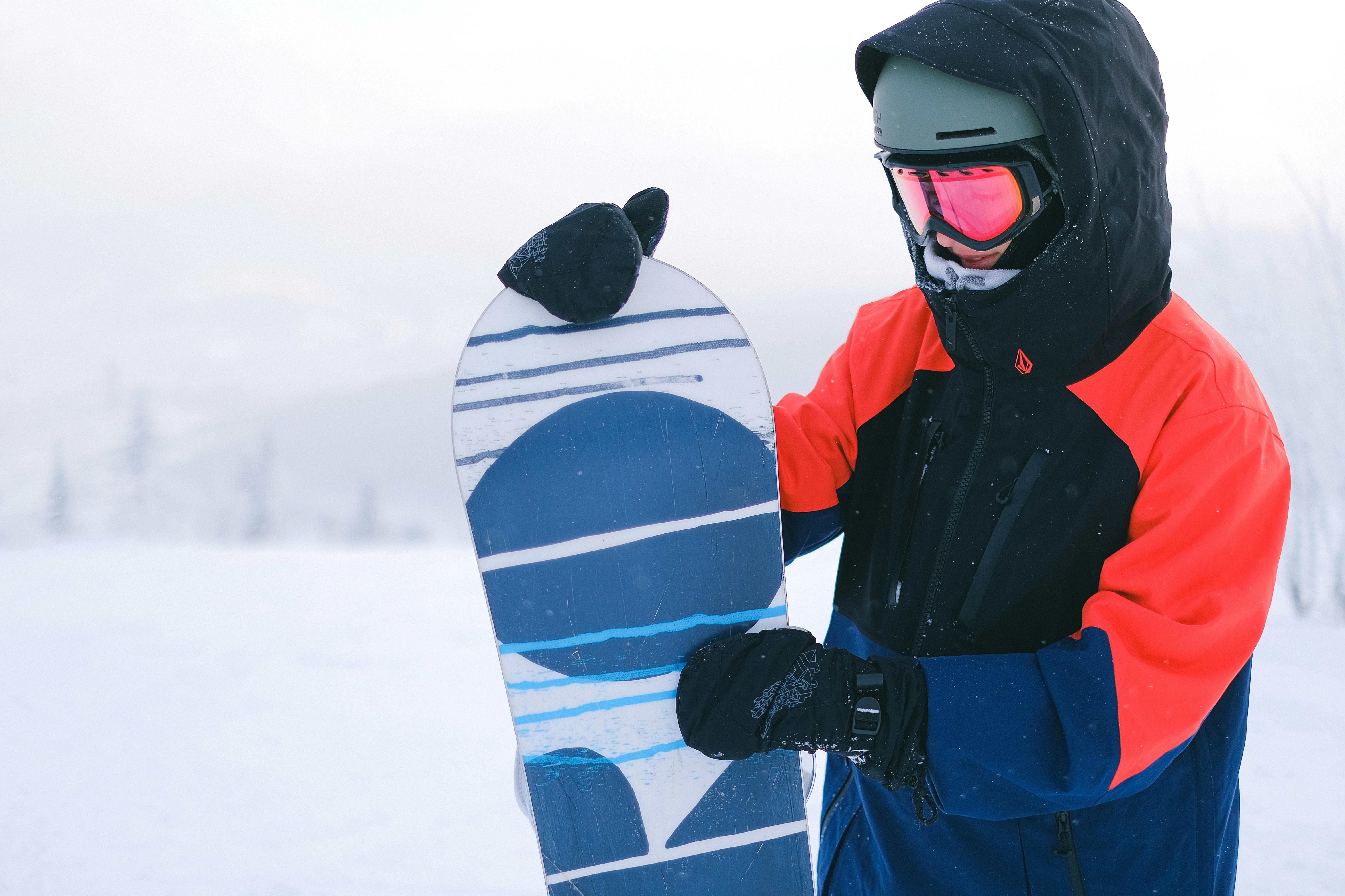 A Person Carrying a Snowboard · Free Stock Photo