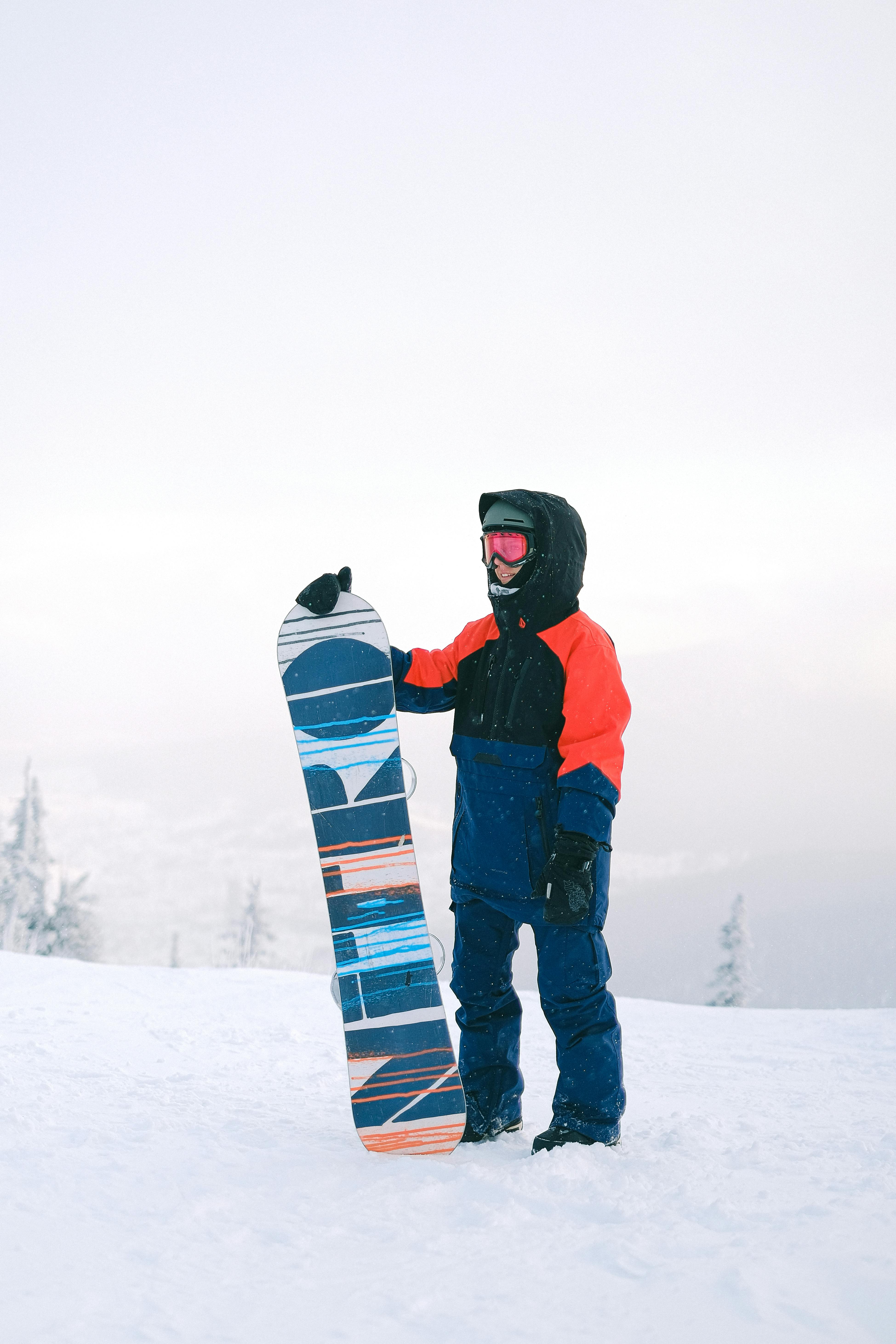 A Person Holding a Snowboard · Free Stock Photo