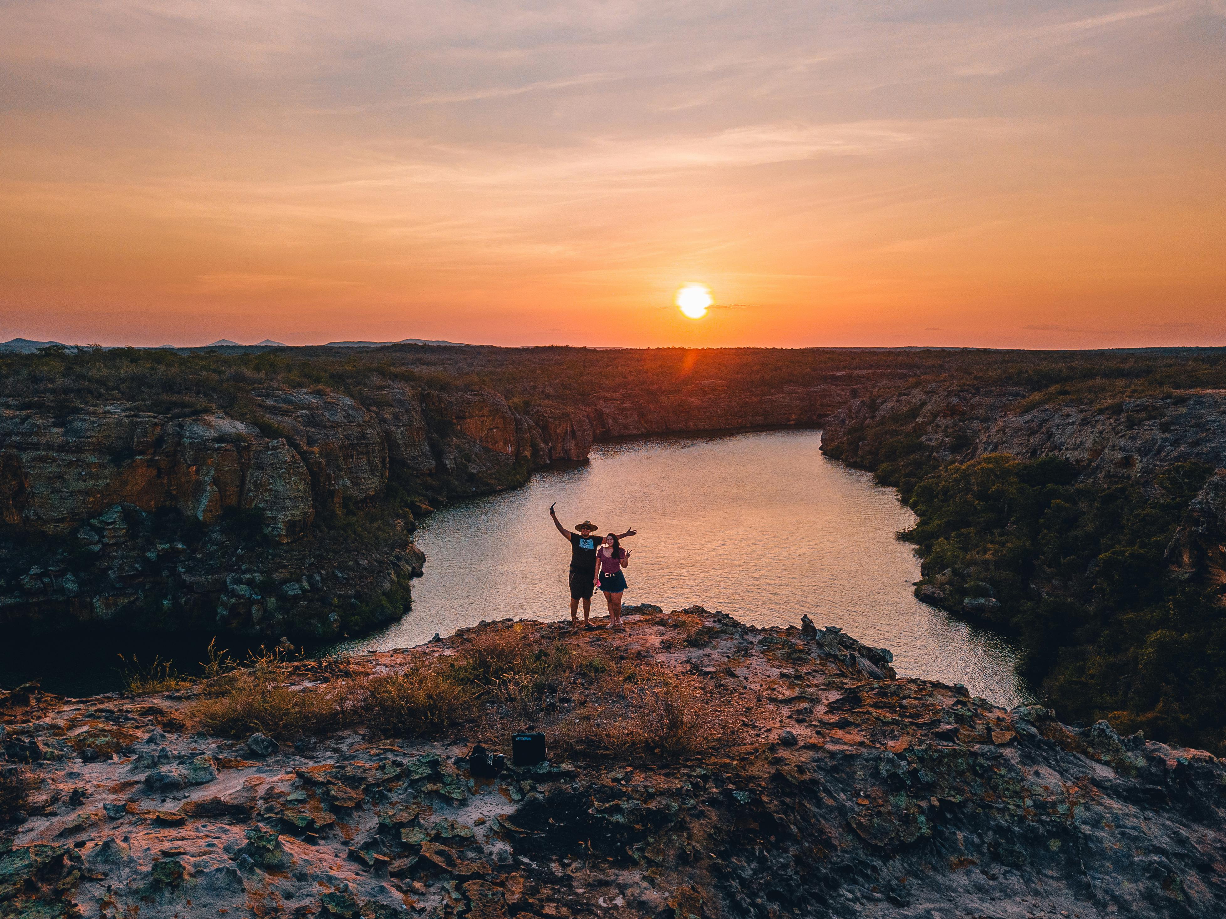 Man and Woman Standing on a Cliff · Free Stock Photo