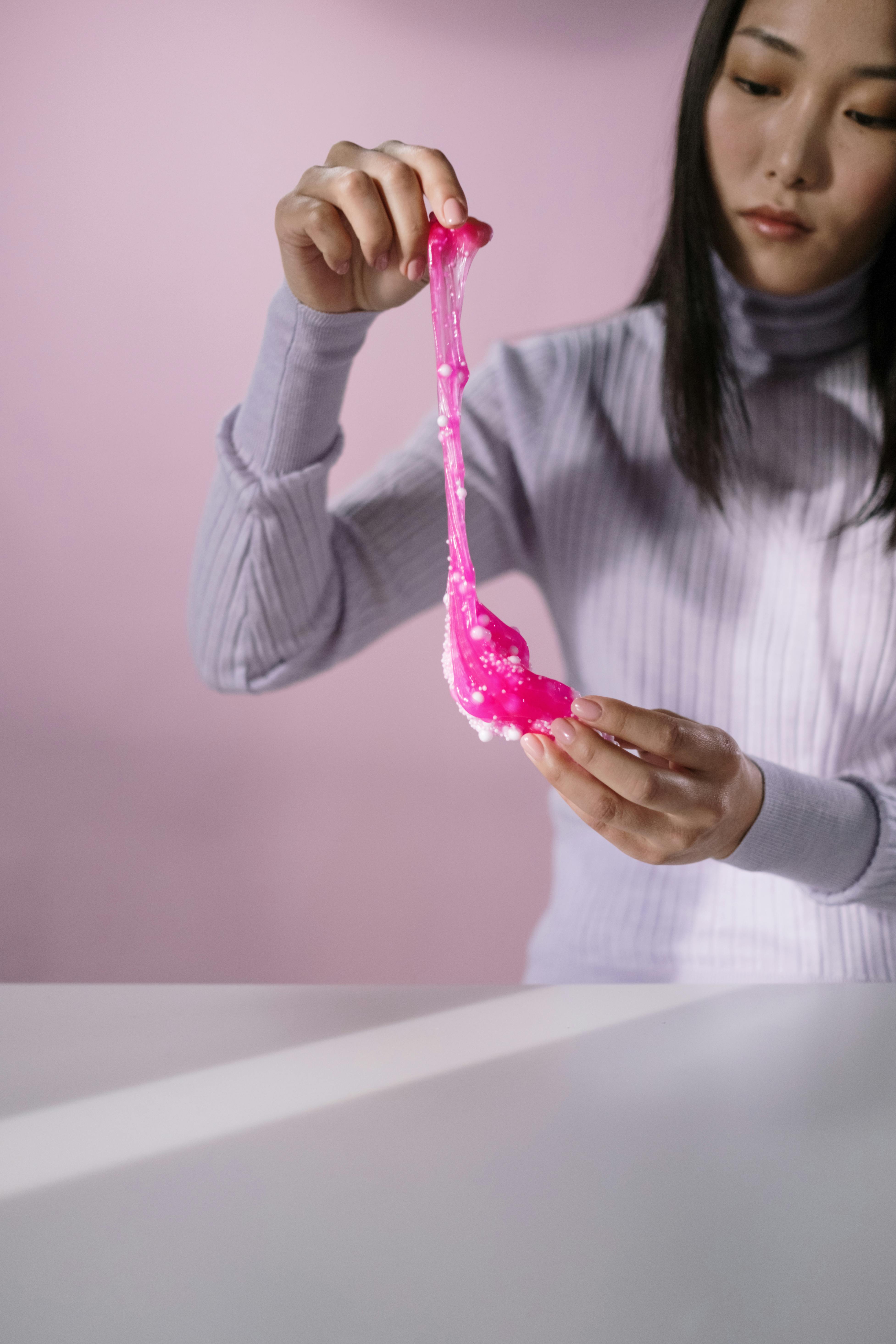 A Woman Holding a Pink Slime · Free Stock Photo