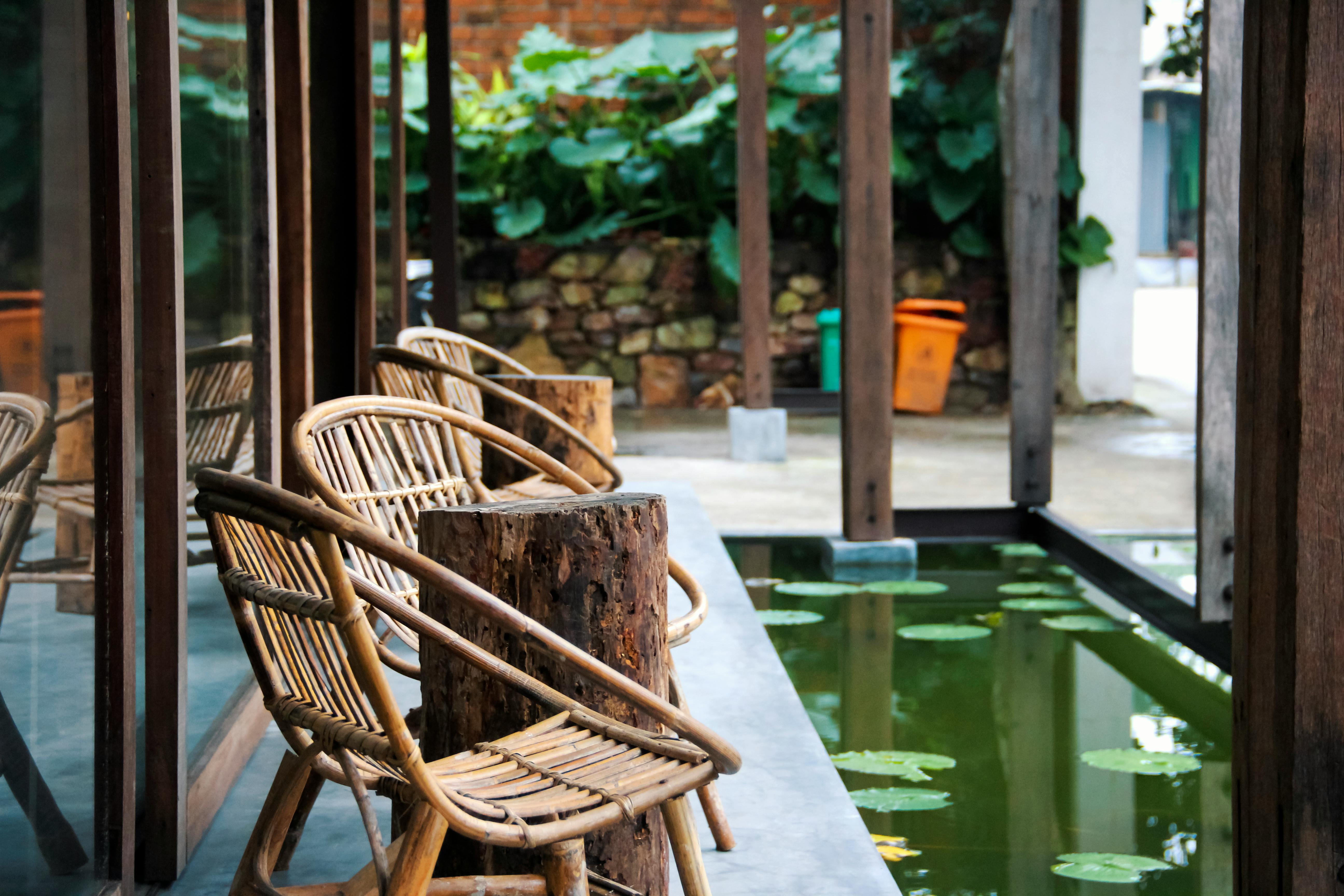 Brown Wooden Chairs and Tables Near the Water Pond · Free Stock Photo