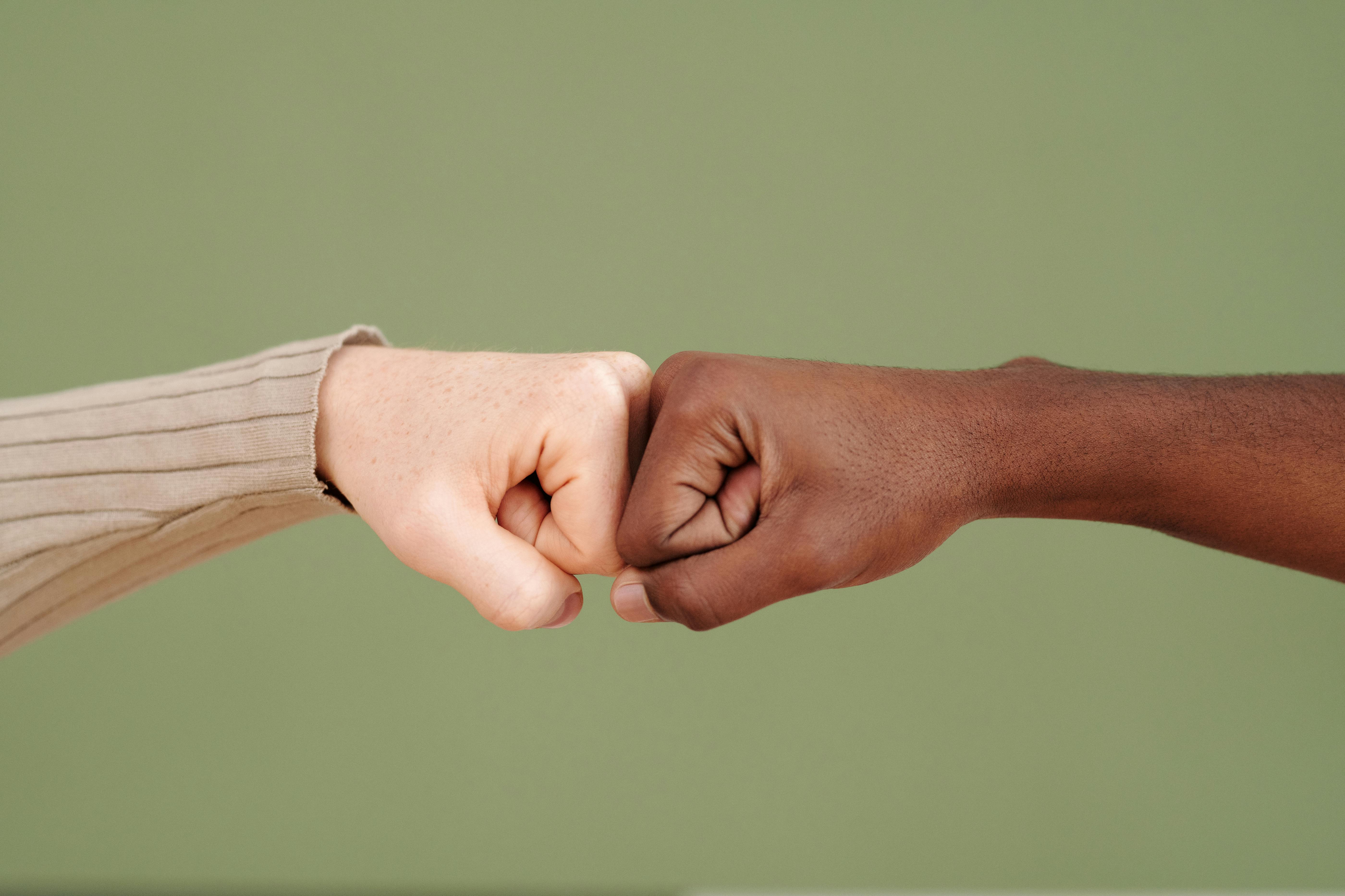 Close-Up Shot of a Fist Bump · Free Stock Photo
