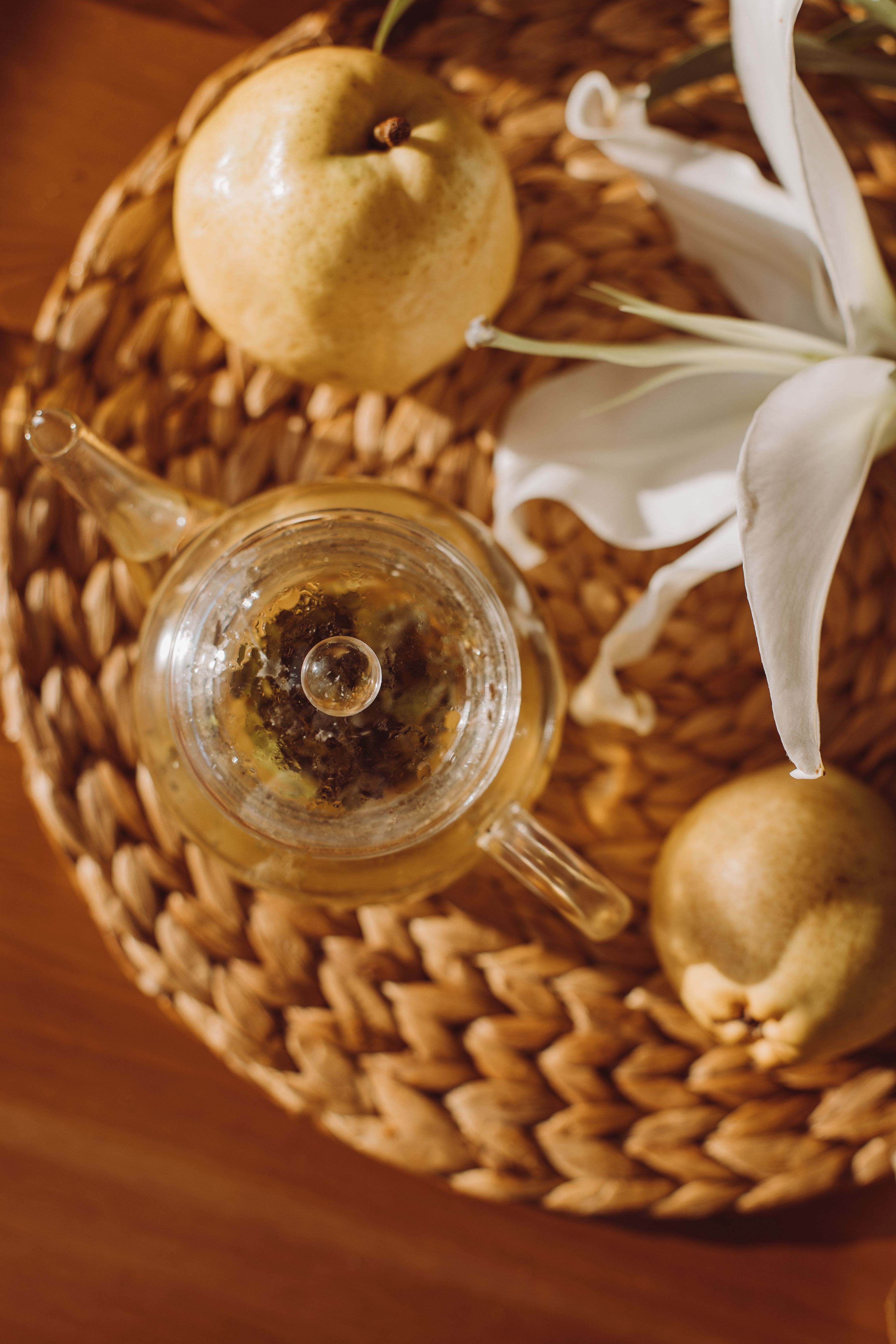 Top View Shot of Teapot on a Woven Plate with Pears on the Side · Free ...
