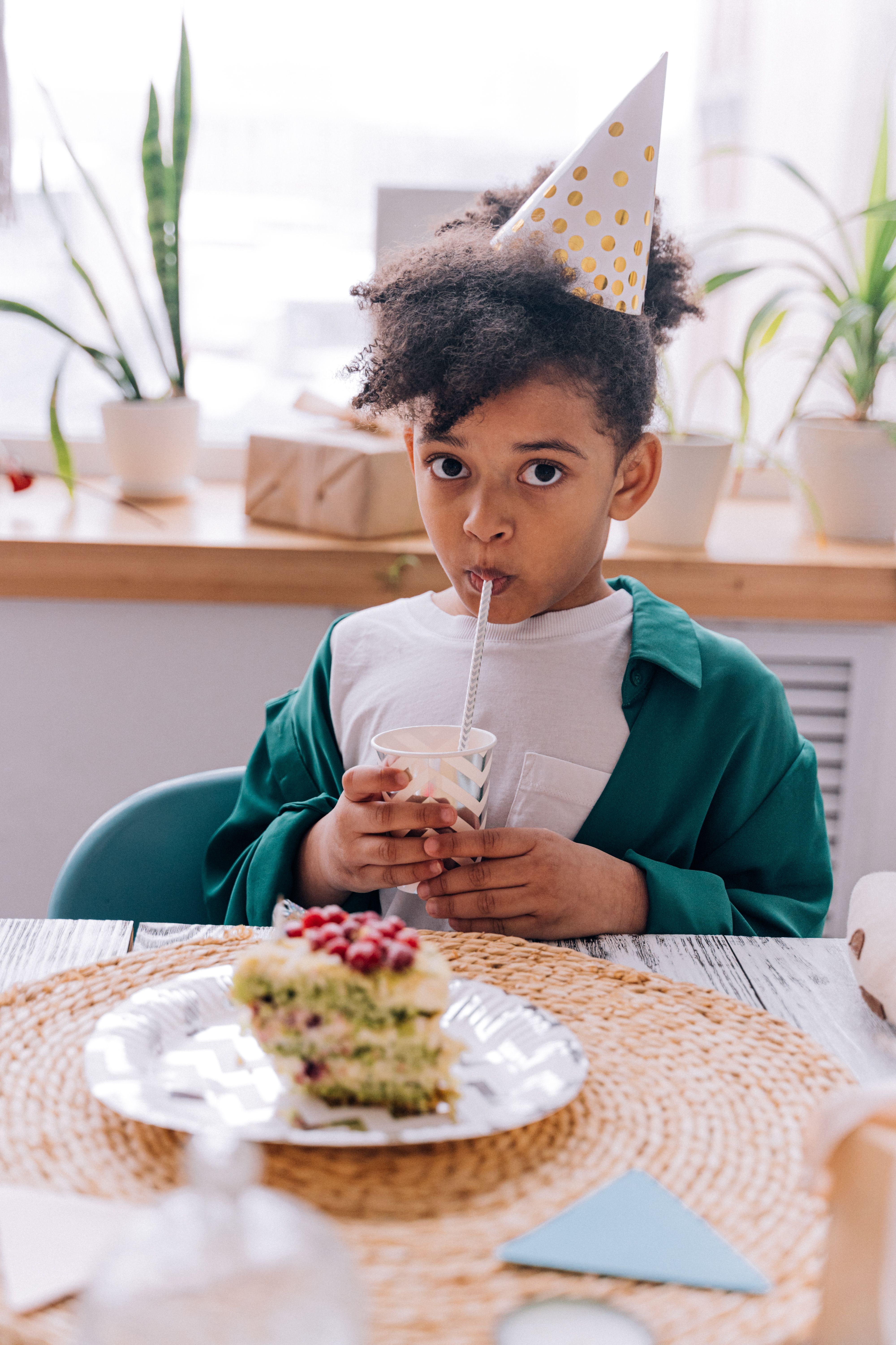 Boy in Green Polo Shirt Eating · Free Stock Photo