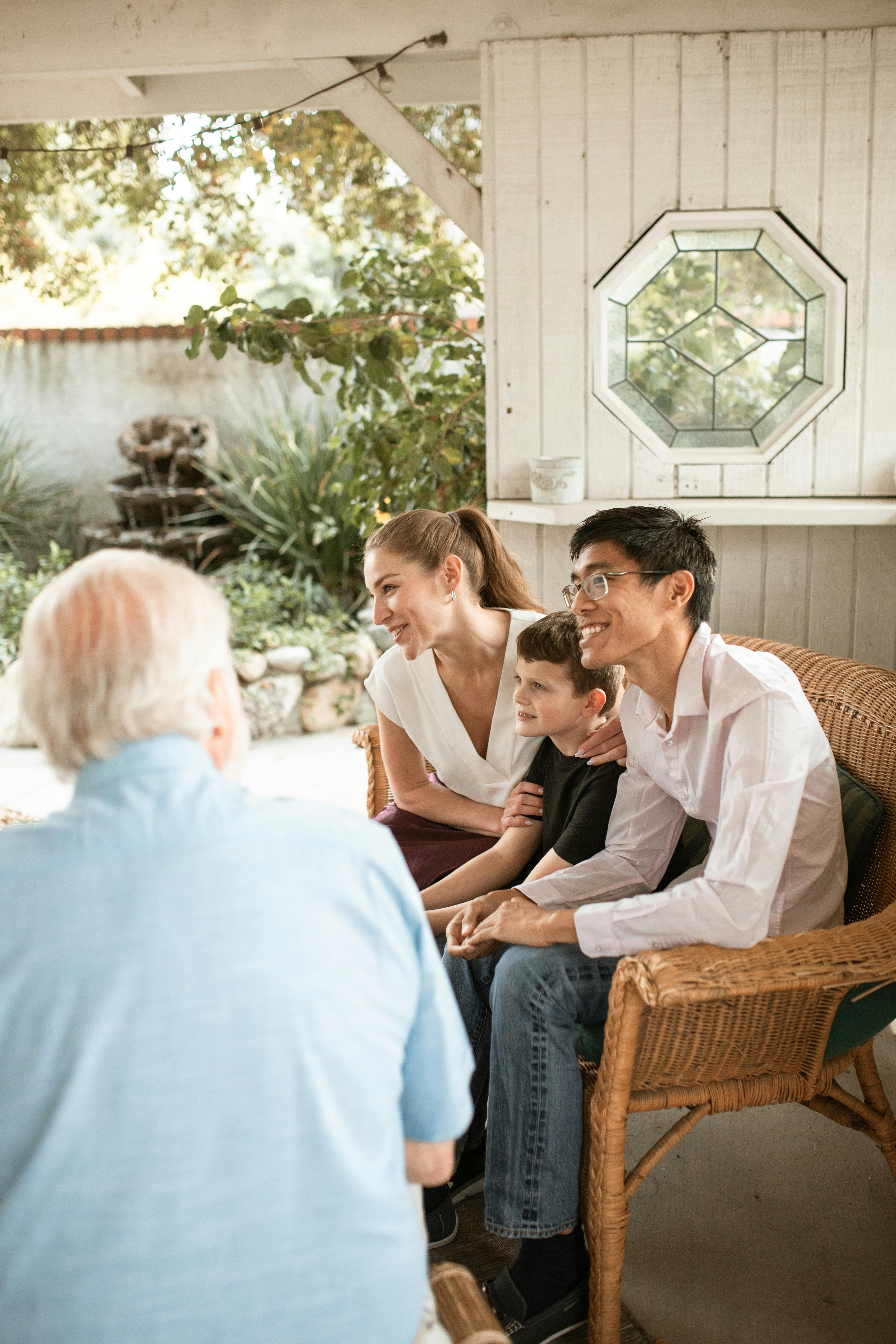 Family Sitting Together · Free Stock Photo