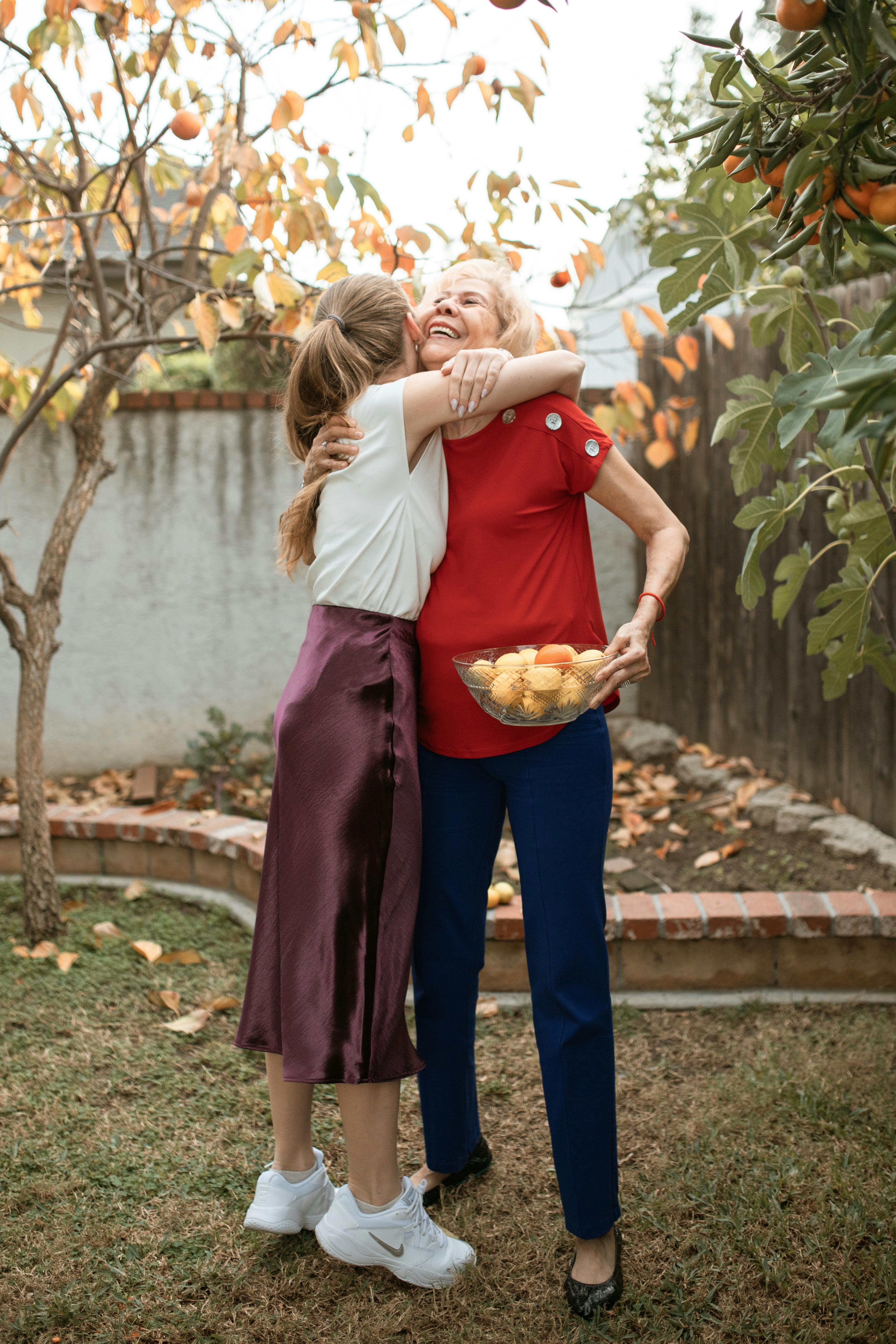 Elderly Woman and a Woman Hugging Each Other in the Grass Field · Free ...