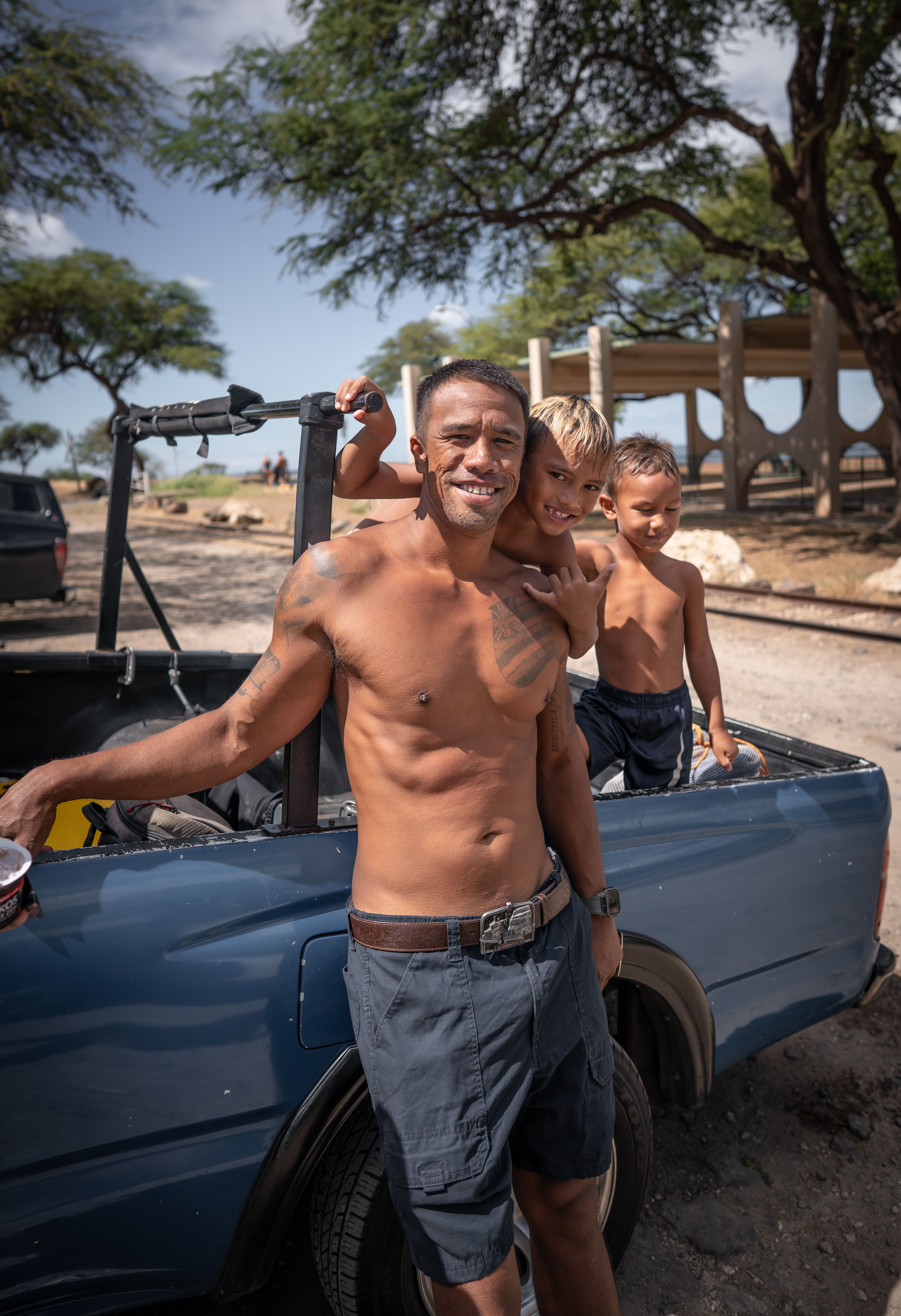 Happy men with kids in street with car · Free Stock Photo