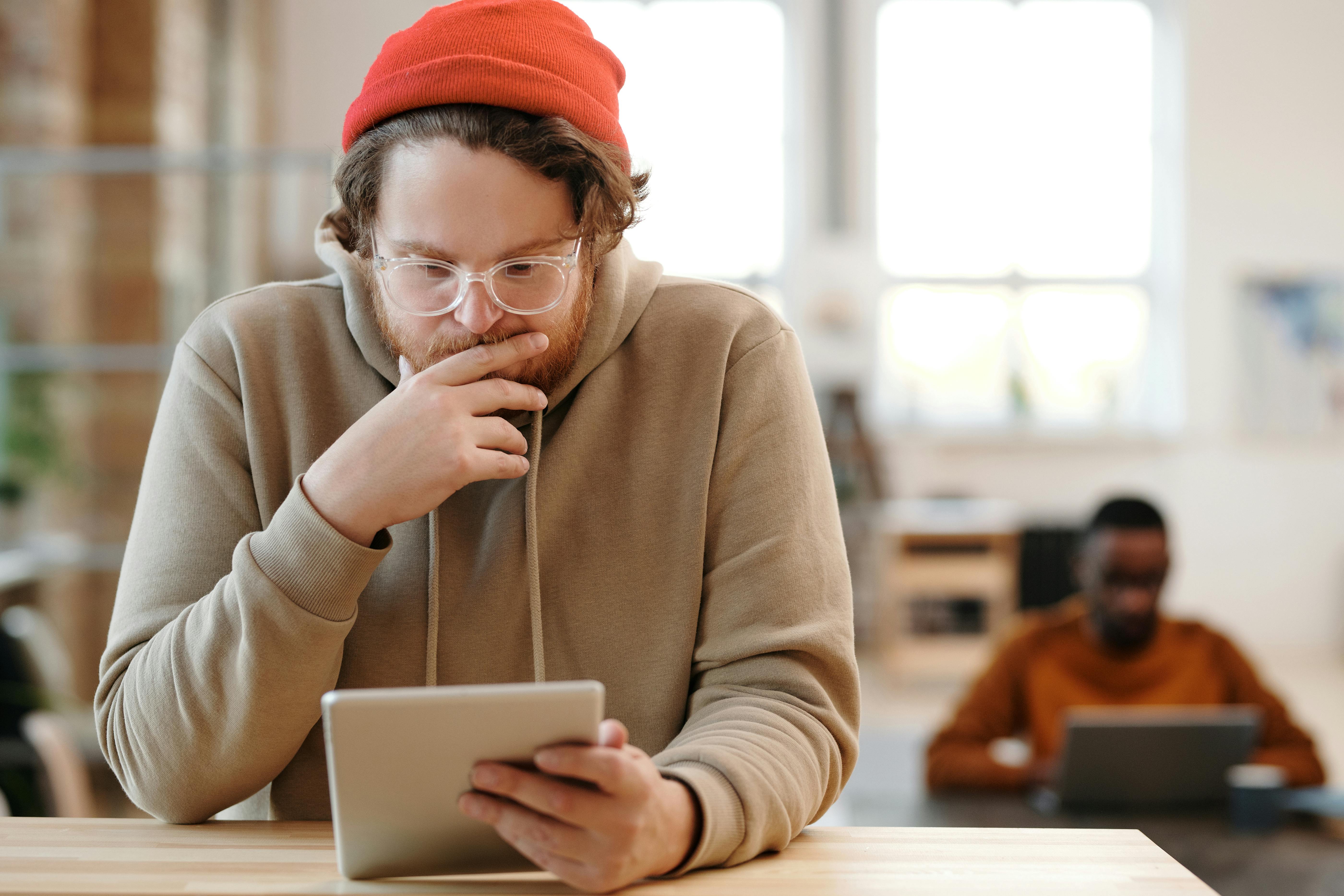 Men Using Electronic Devices Indoors · Free Stock Photo