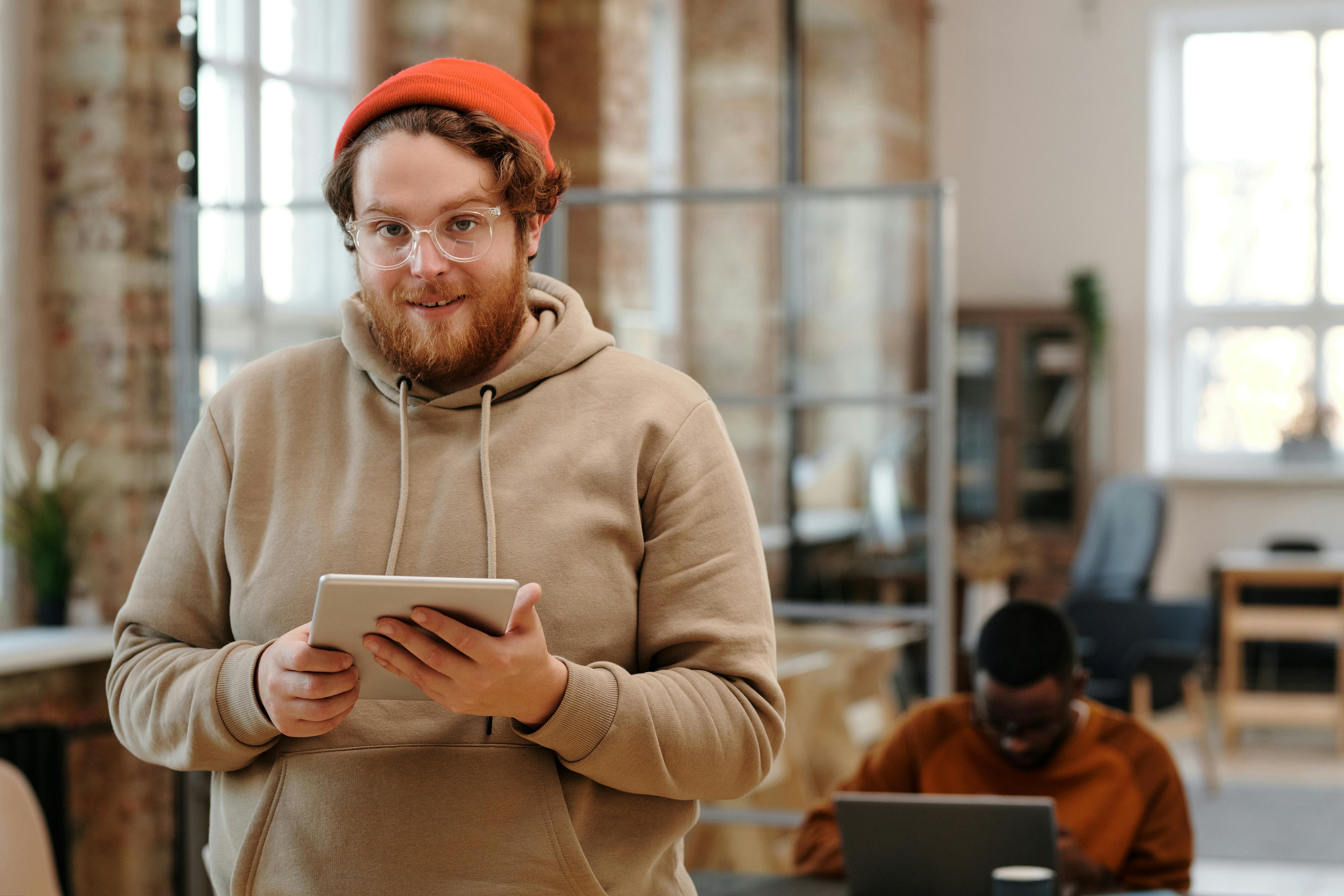 A Man Using Modern Electronic Devices indoors · Free Stock Photo