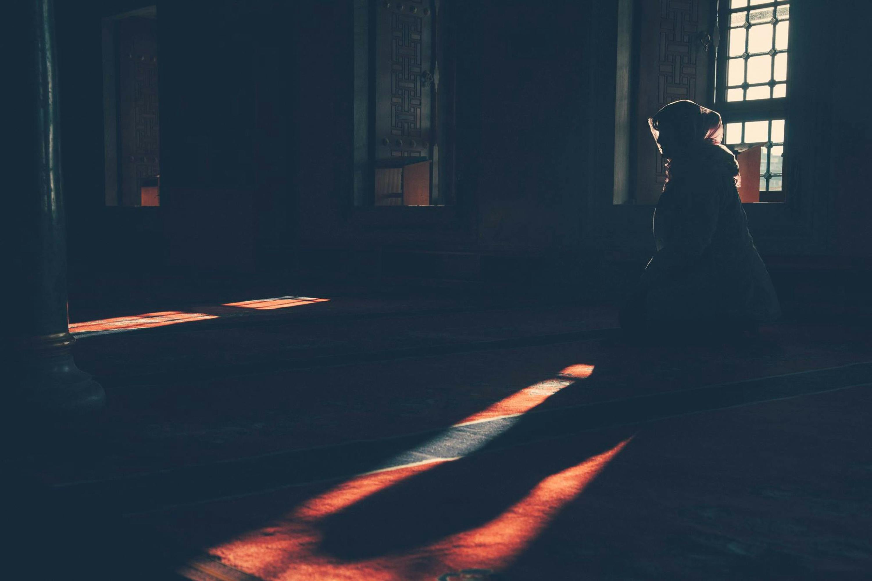 Person Sitting in Dark Room · Free Stock Photo