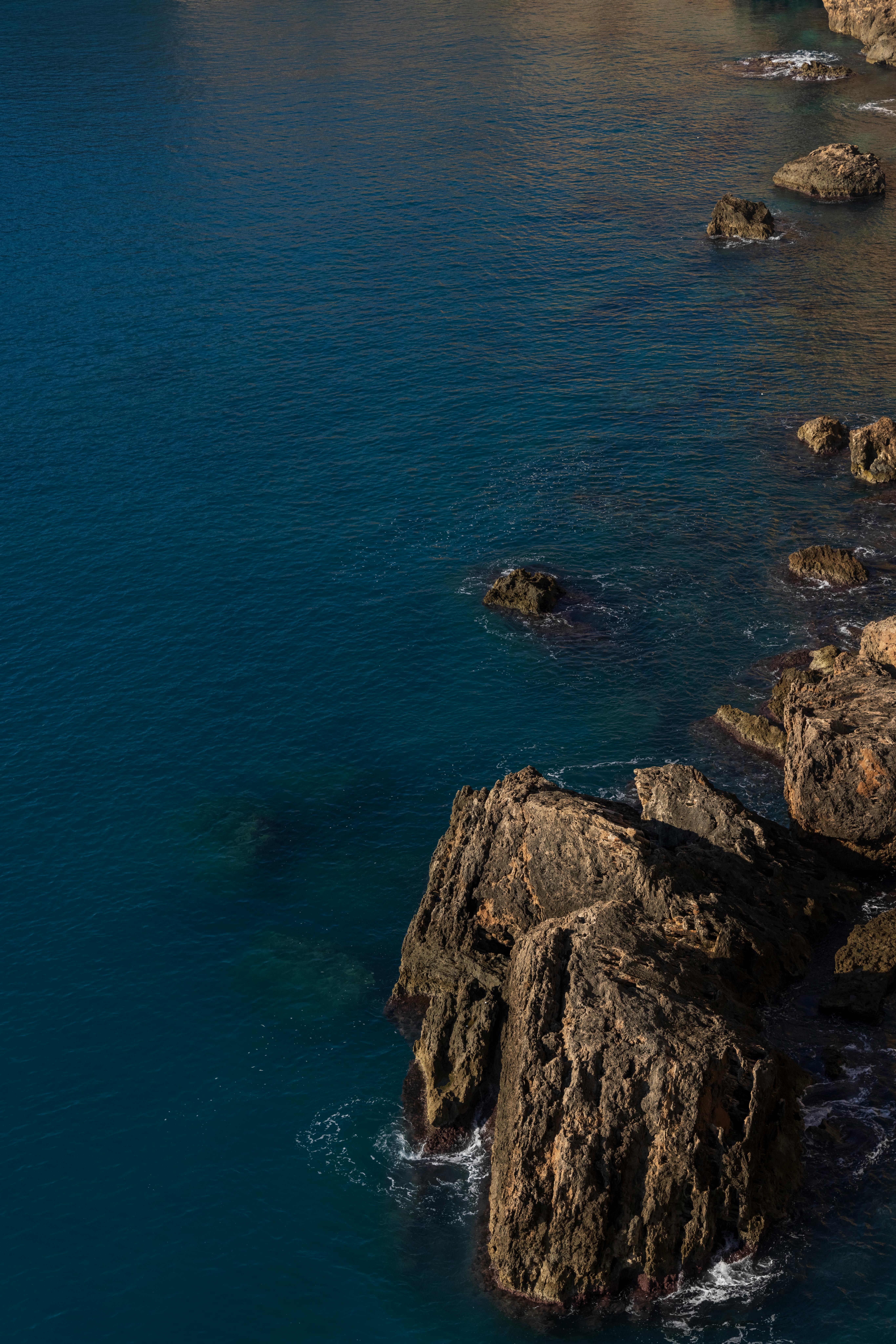 A Big Rock Formation in the Sea · Free Stock Photo