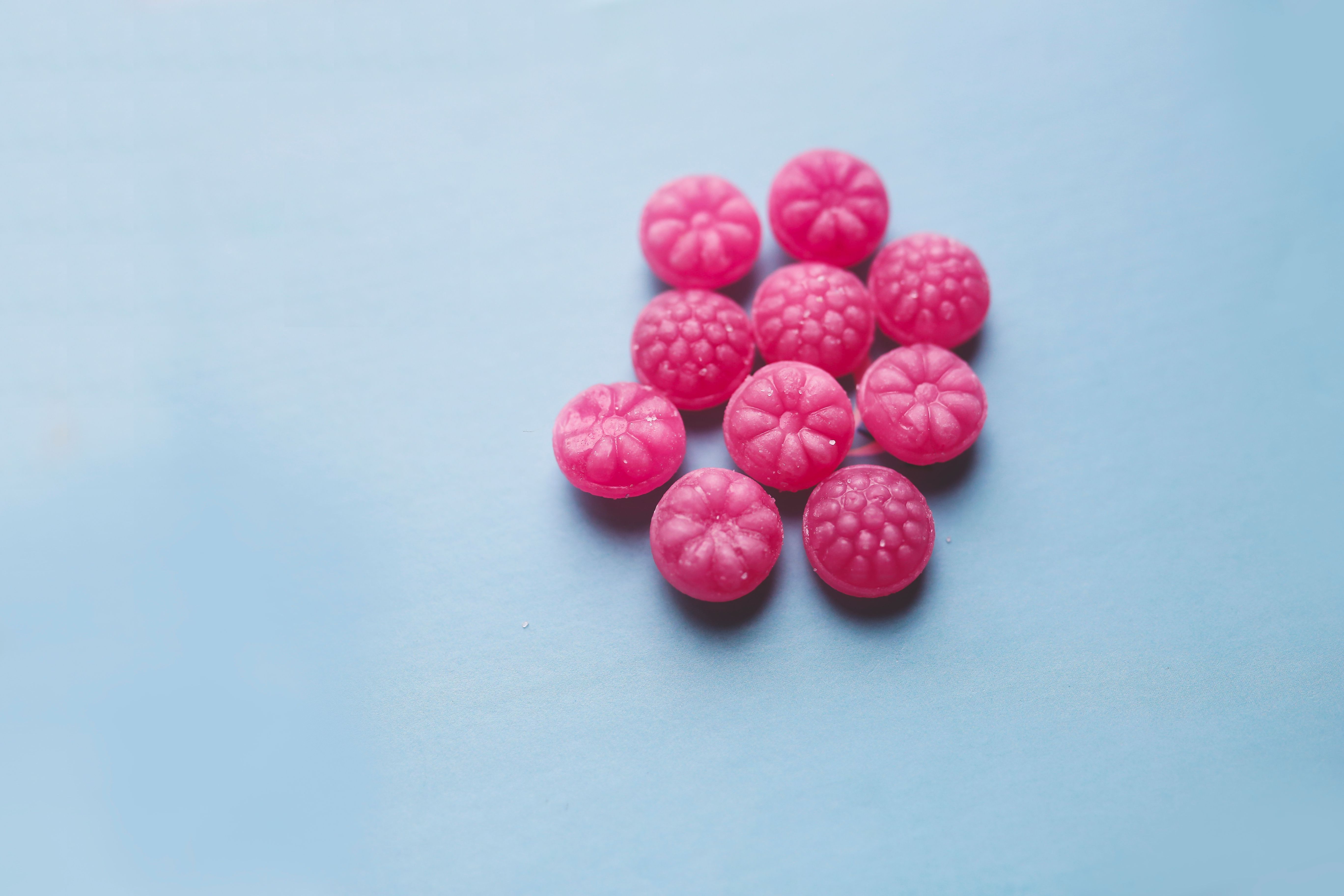 Pink Scrabble Tiles on White Background · Free Stock Photo