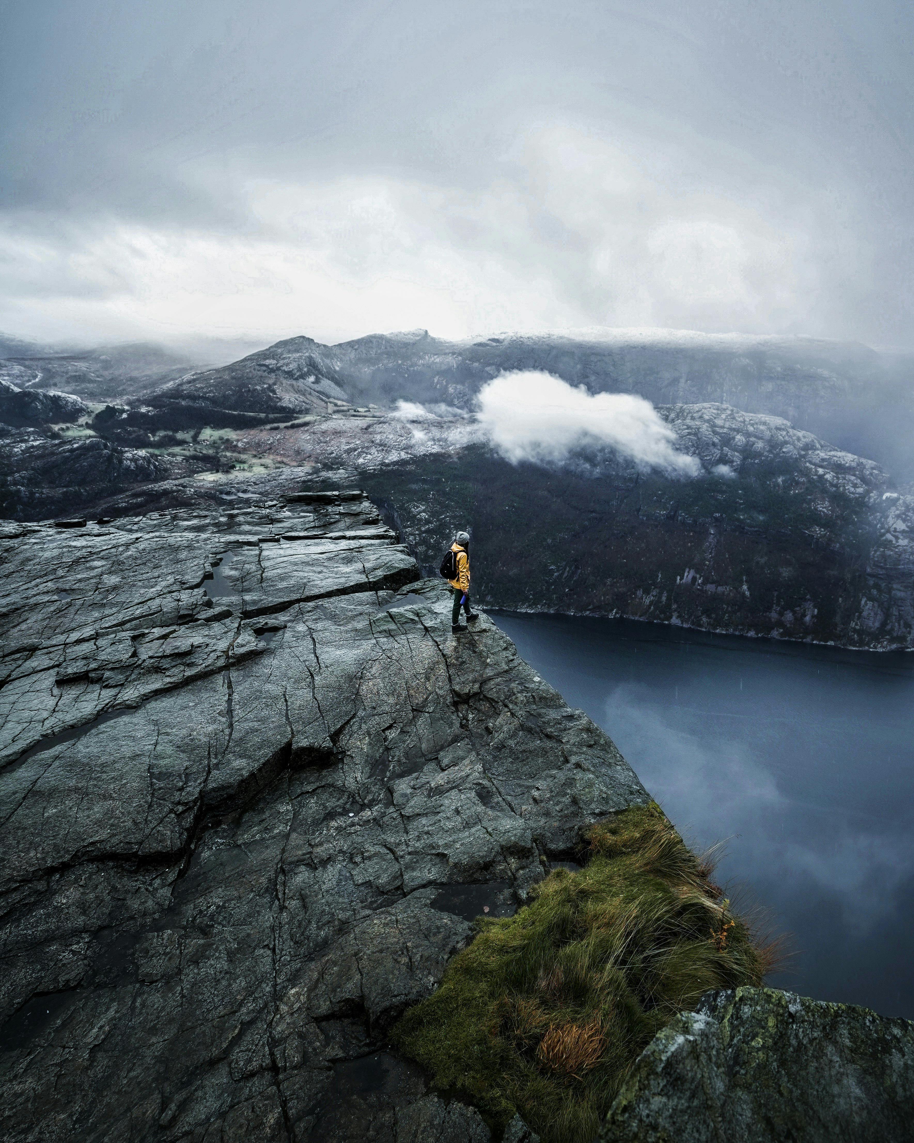 People Sitting on the Edge of a Cliff · Free Stock Photo