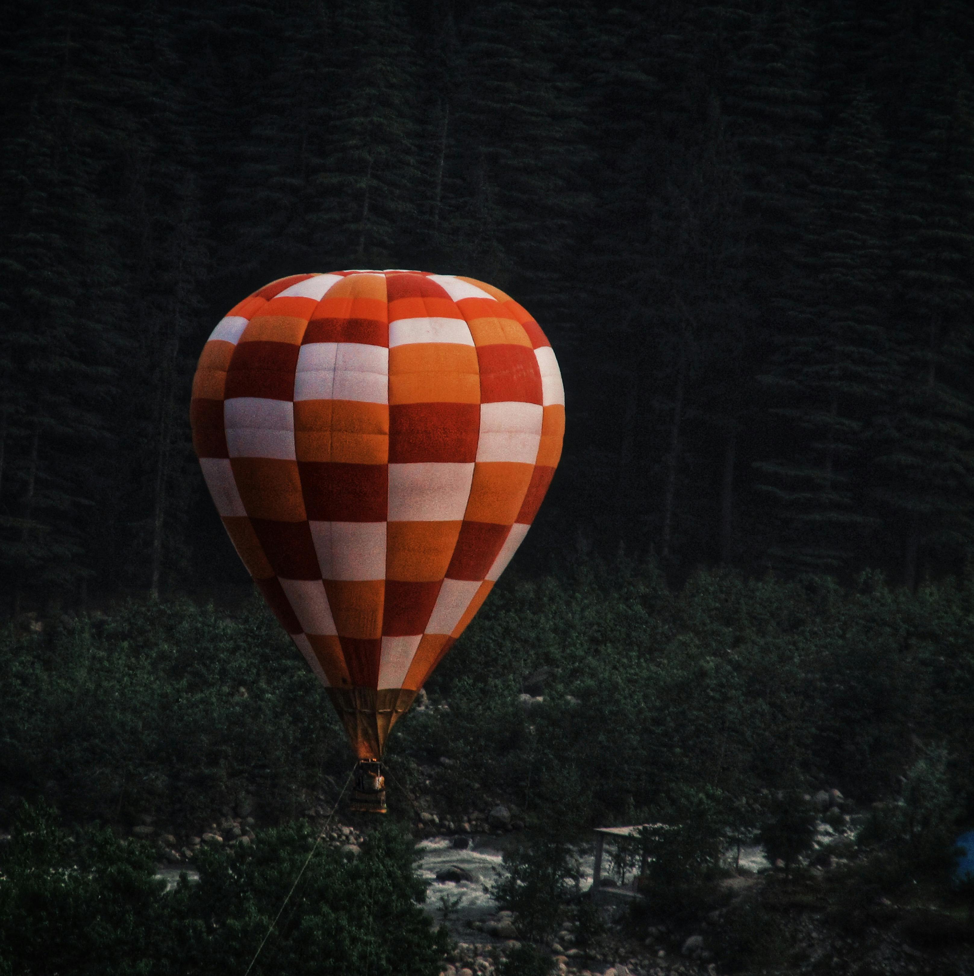 White, Orange and Red Hot Air Balloon Flying · Free Stock Photo