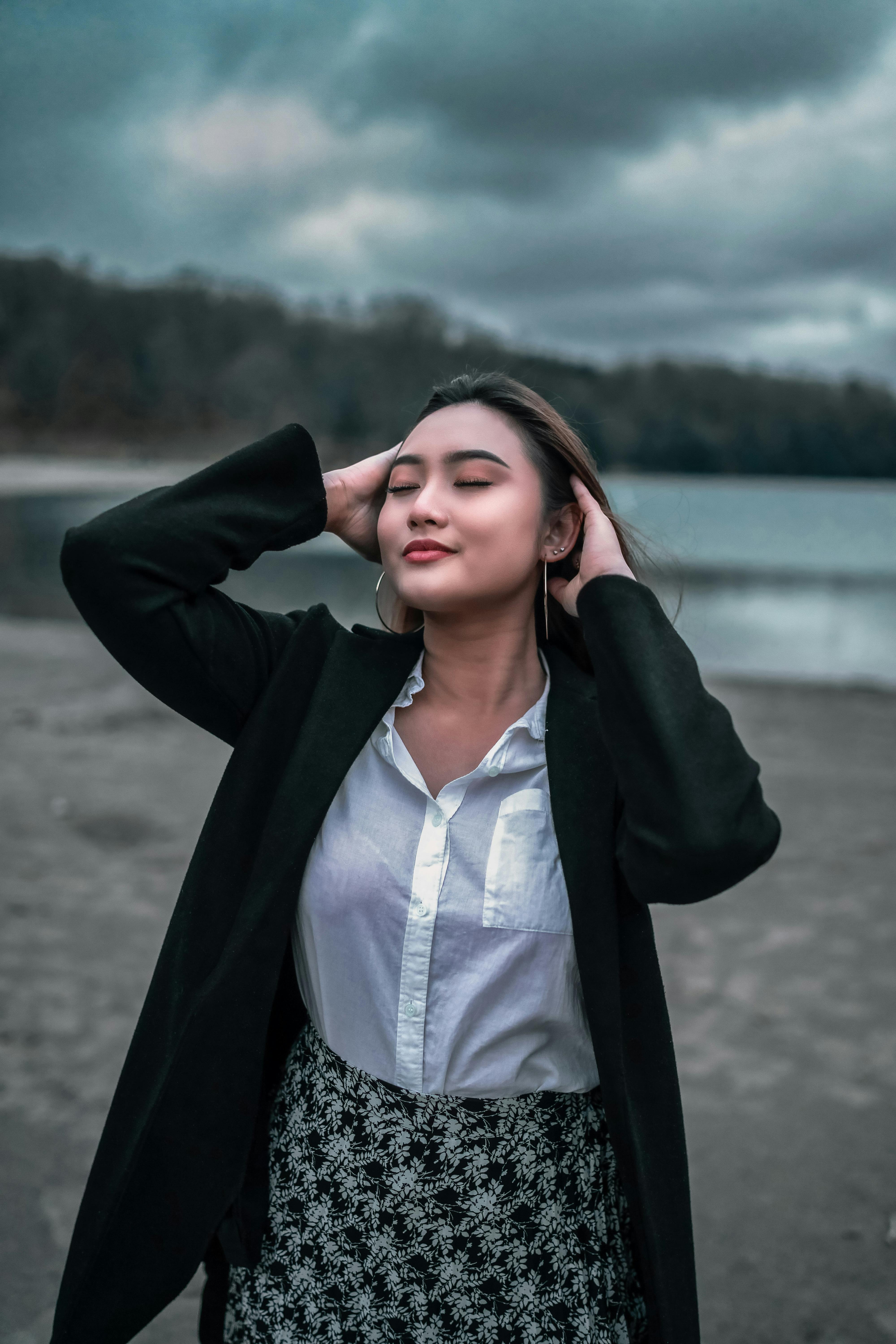 Woman in Black Jacket Doing Wacky Pose · Free Stock Photo