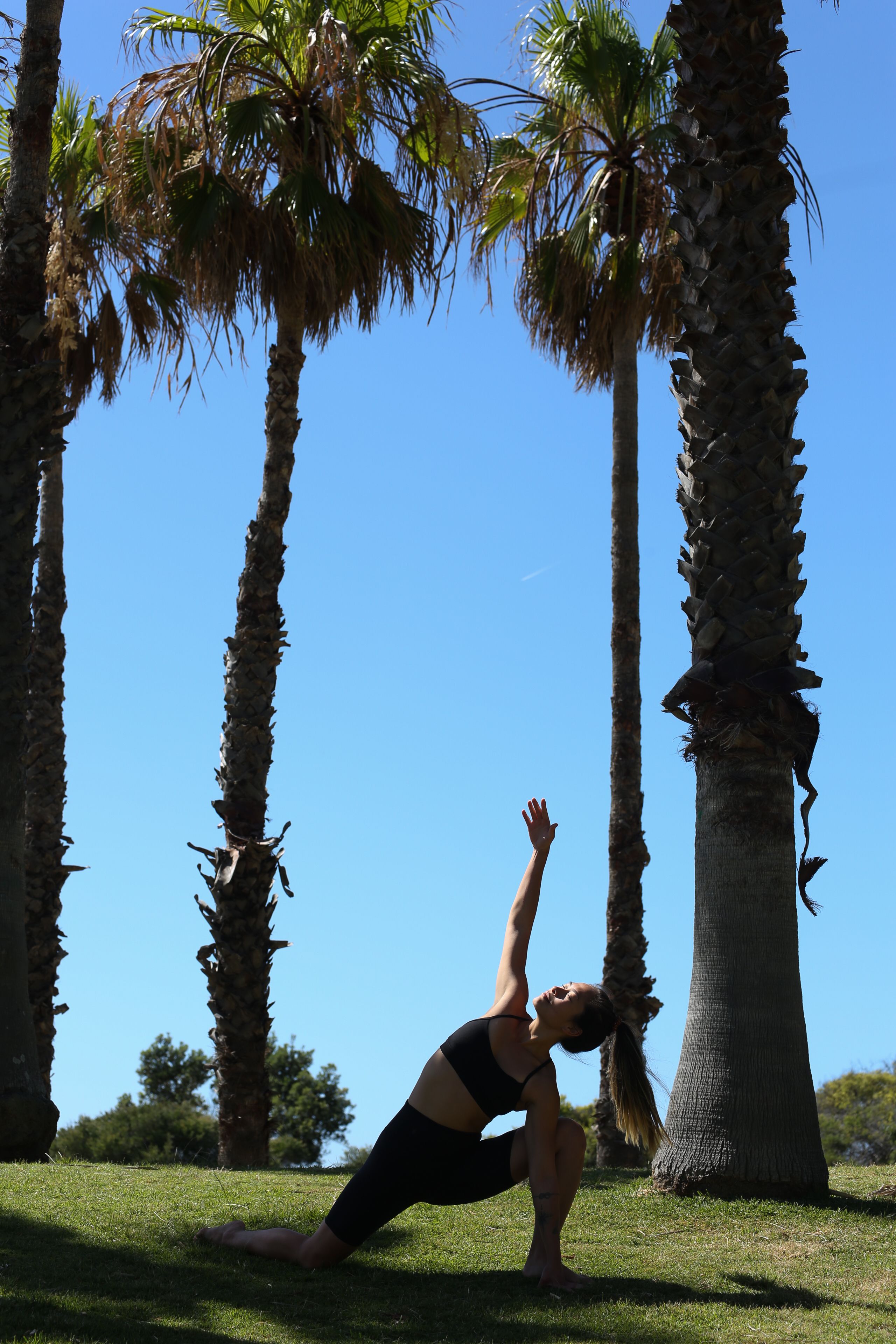 A Woman Doing Yoga Under the Blue Sky · Free Stock Photo