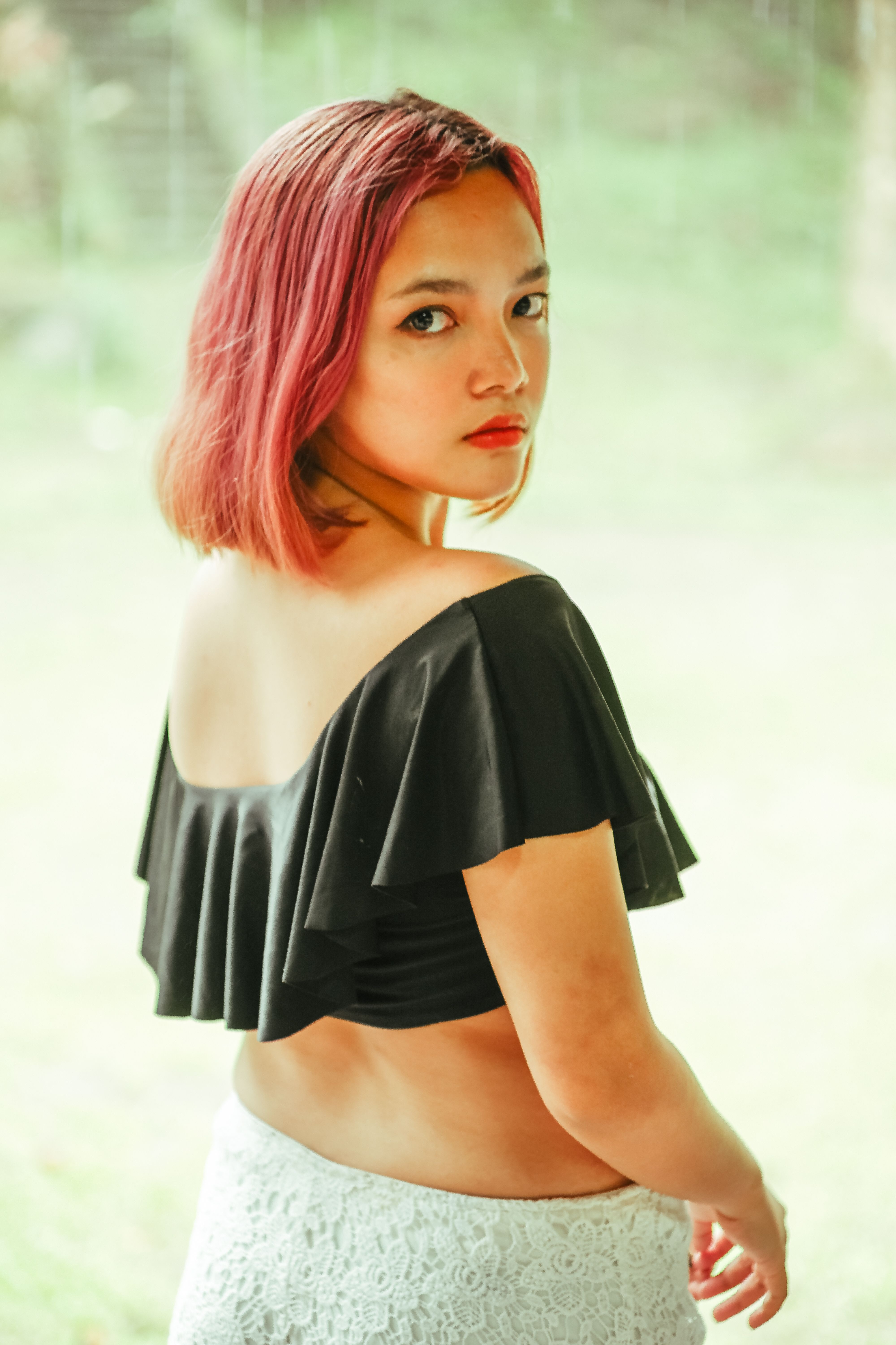 Women Posing Back to Back in Dresses · Free Stock Photo