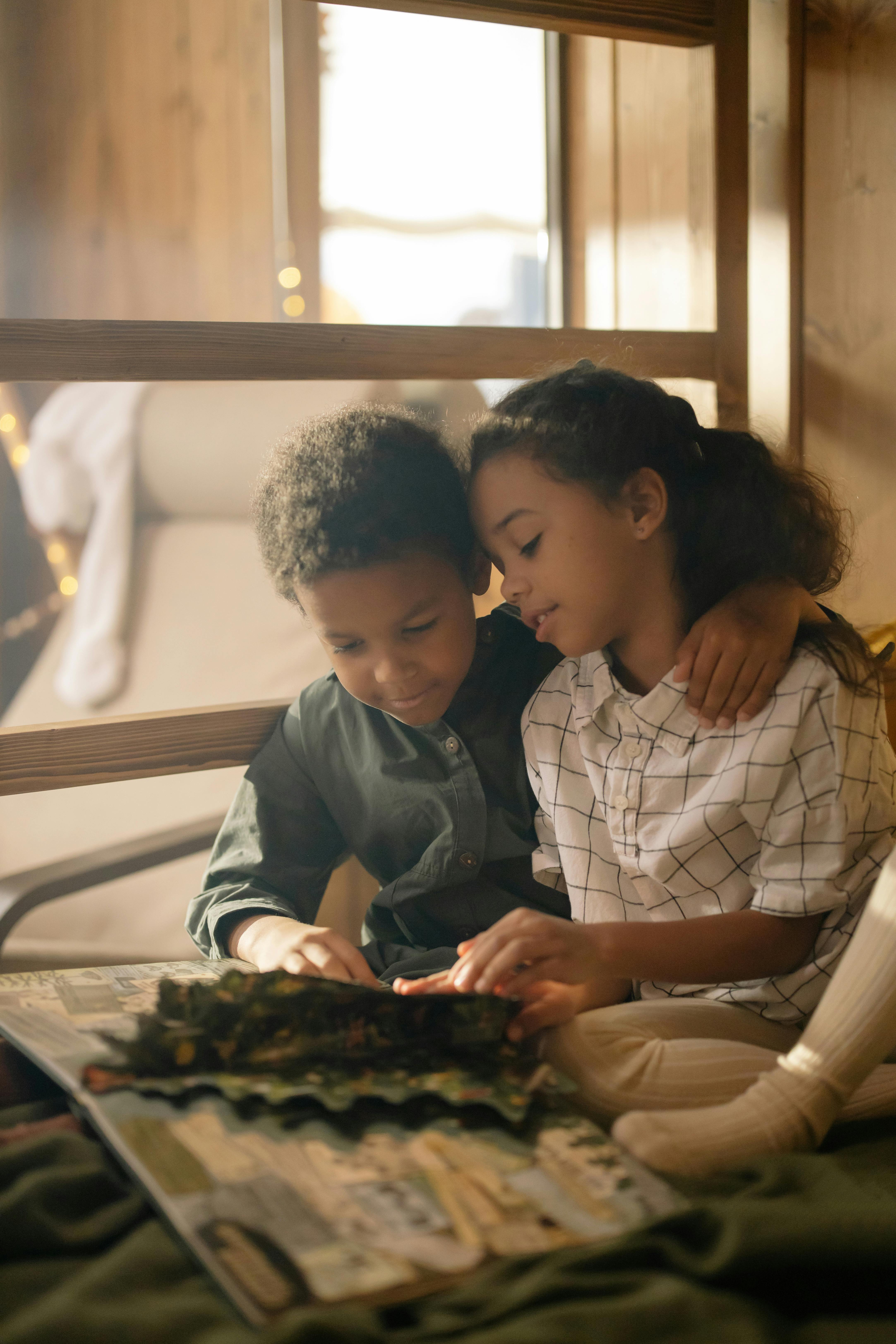 Two Kids Reading a Fairy Tale Book · Free Stock Photo
