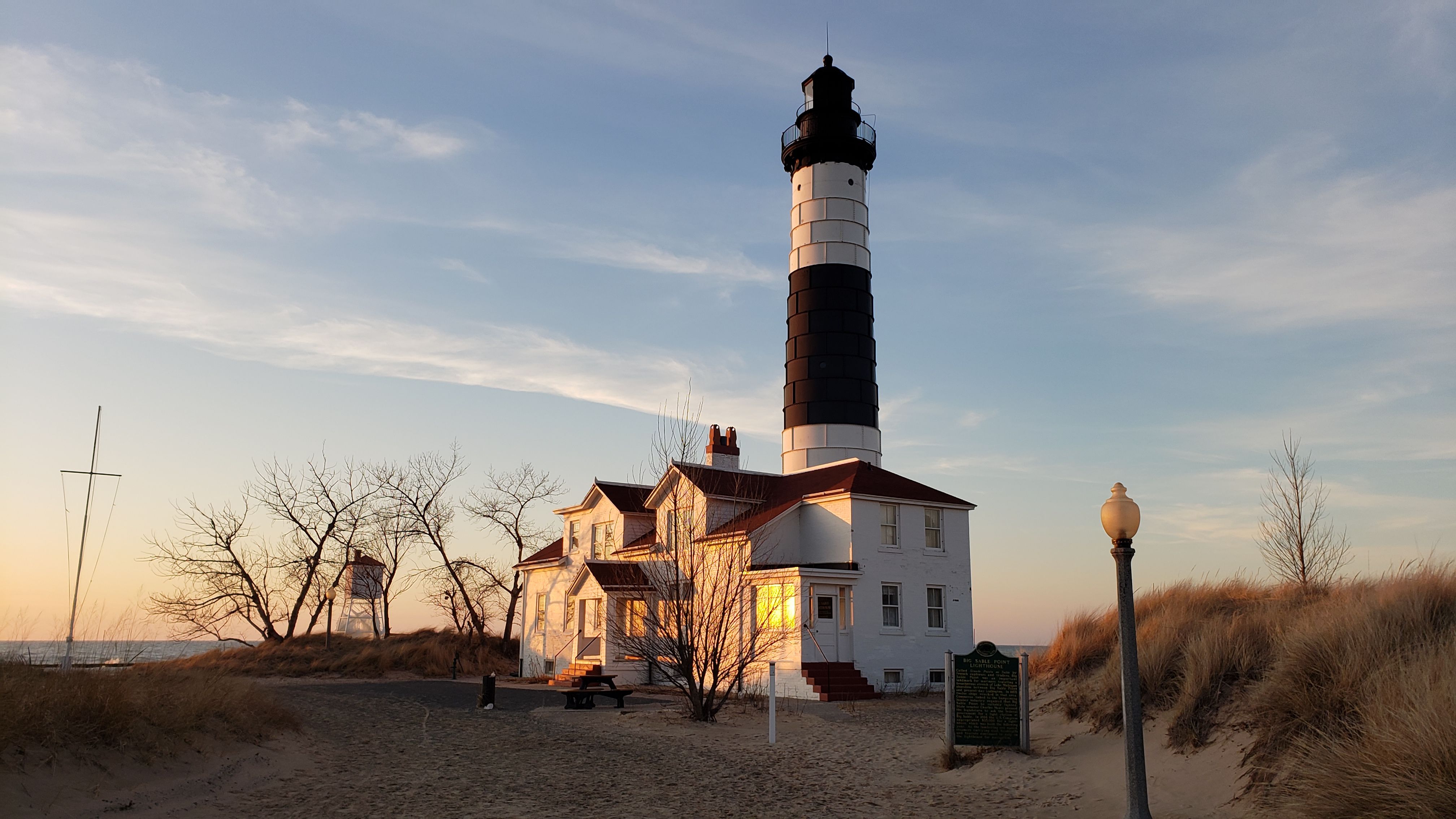 Lighthouse on Beach at Dusk · Free Stock Photo