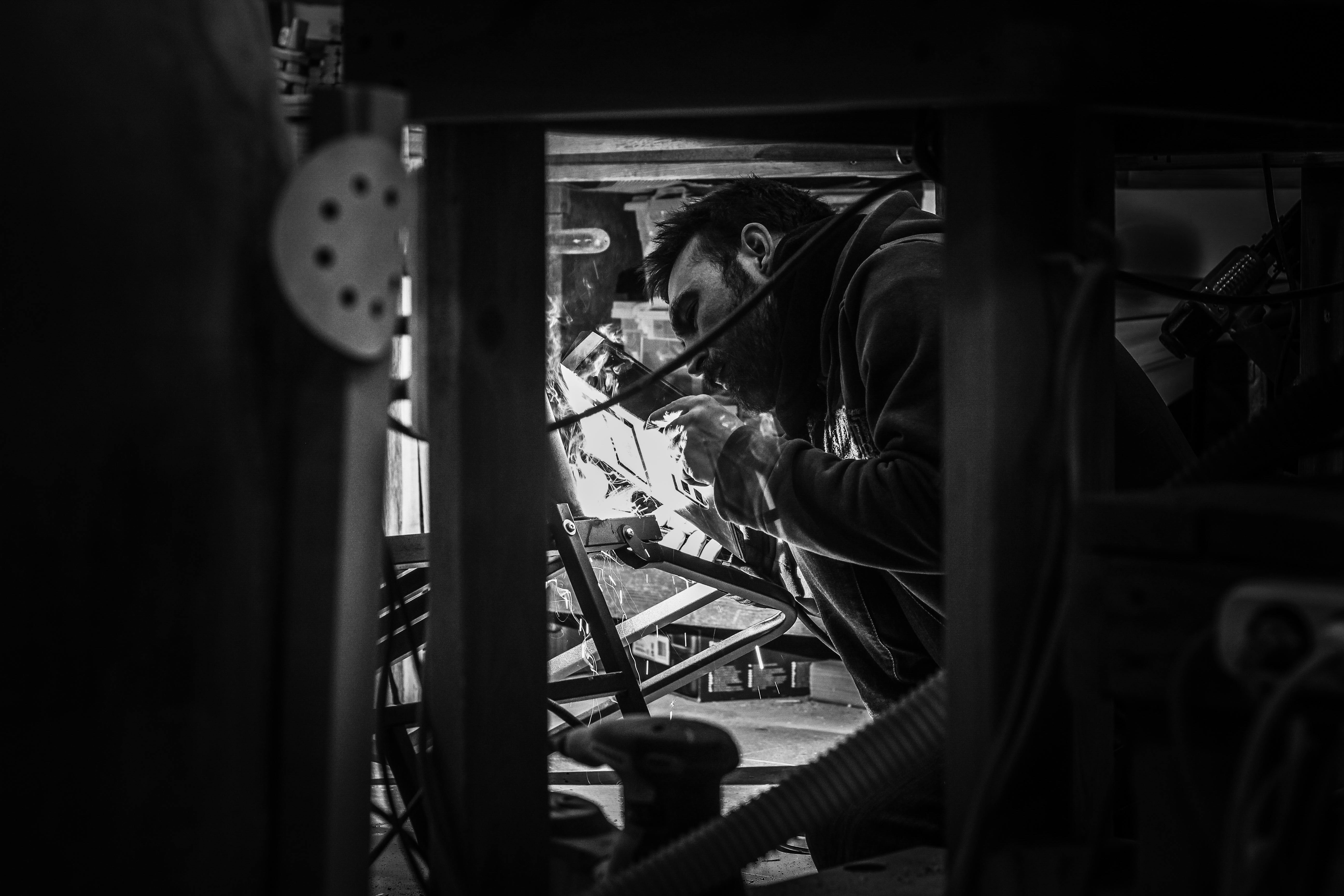 Man Working in a Repair Shop · Free Stock Photo