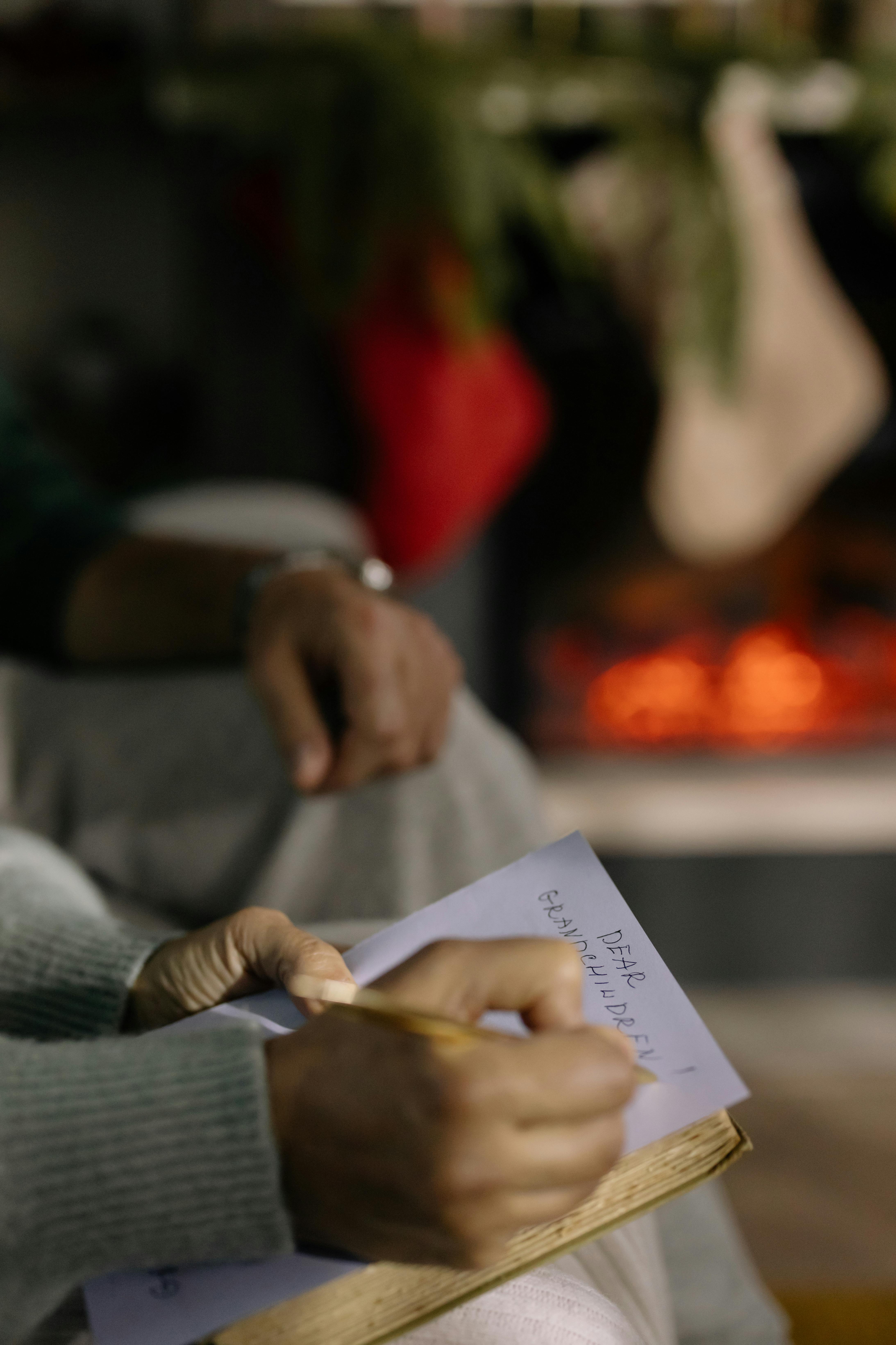 Person Writing on White Paper · Free Stock Photo