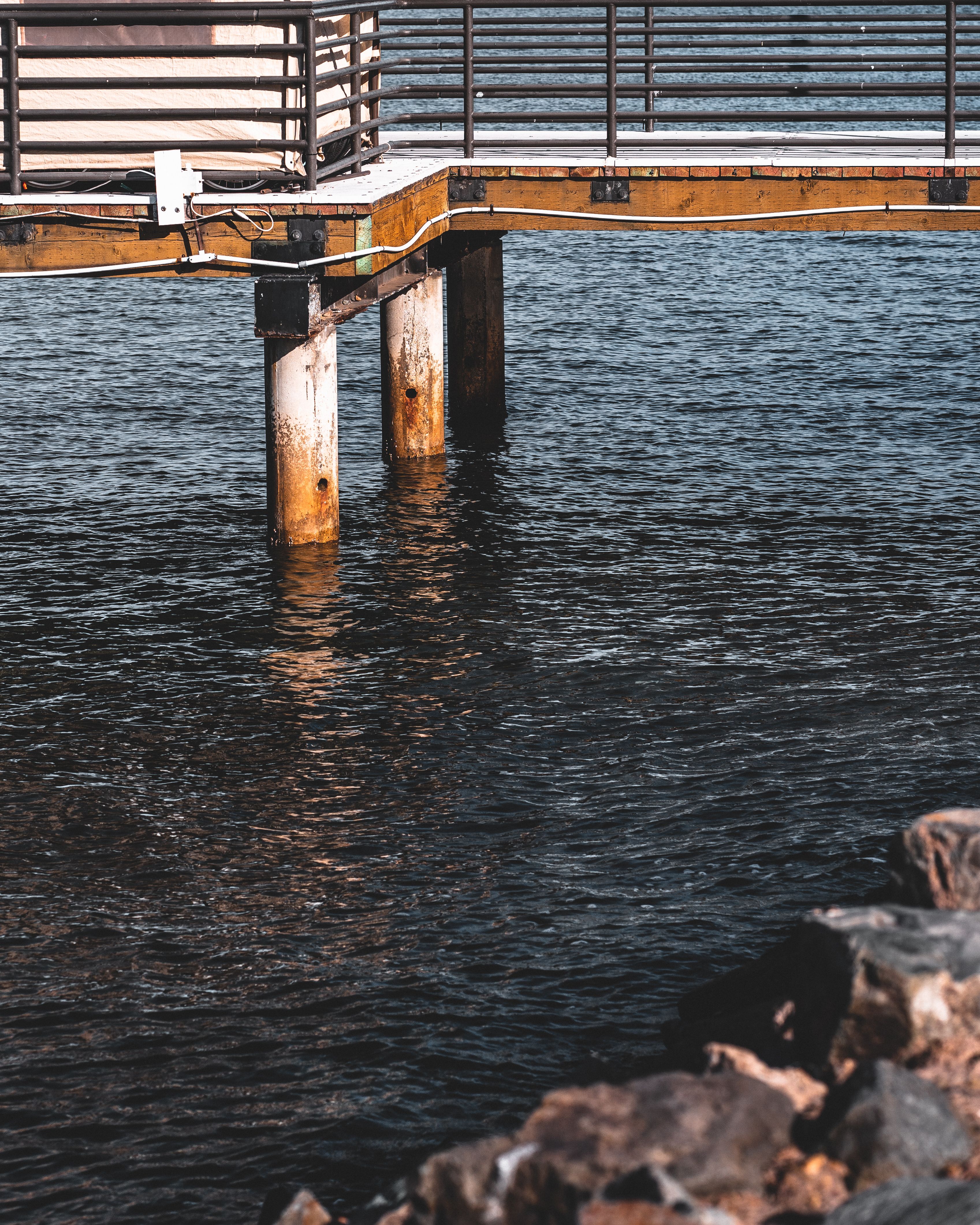 Brown Wooden Structure on Body of Water · Free Stock Photo