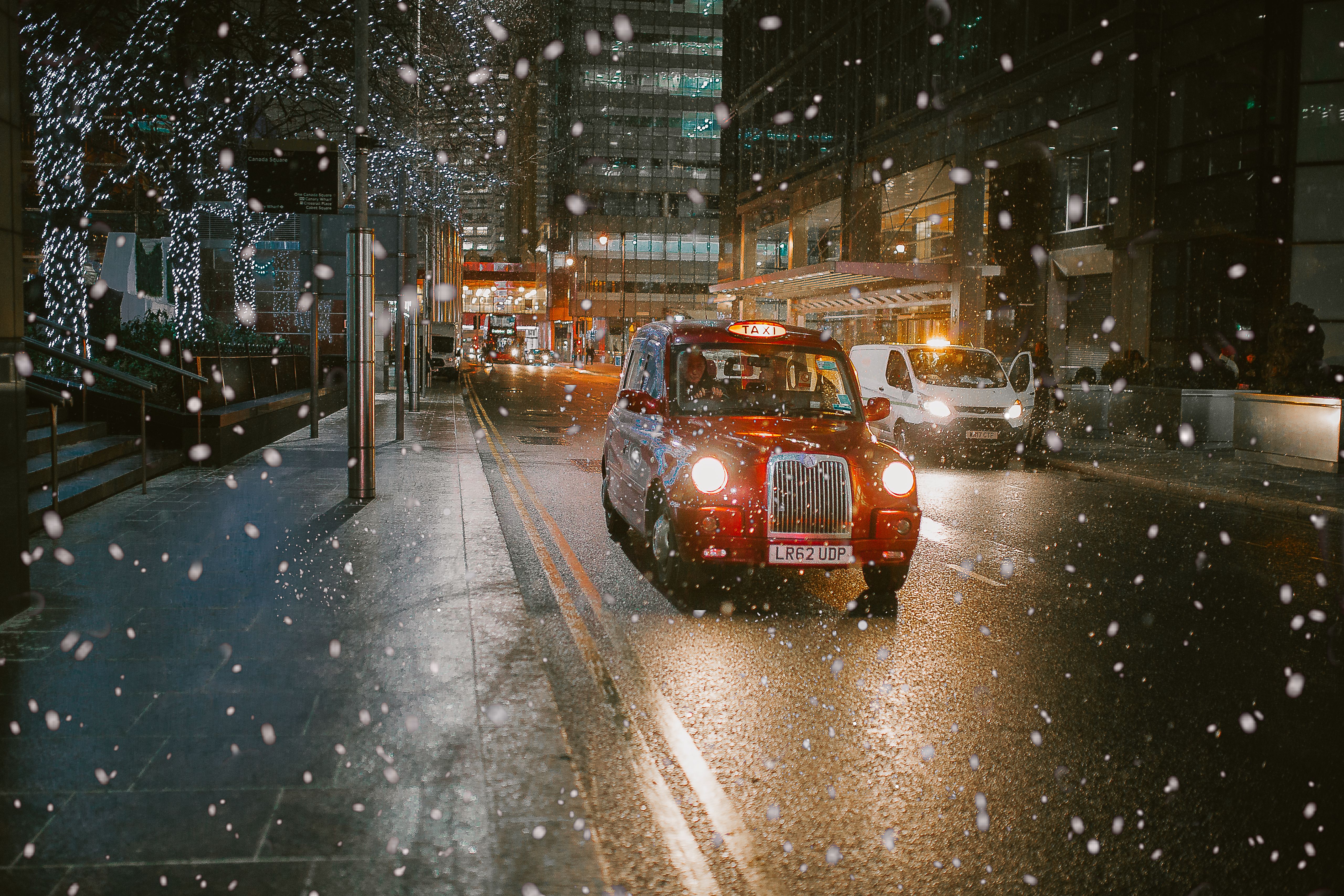 A Red Taxi on Road during Nighttime · Free Stock Photo