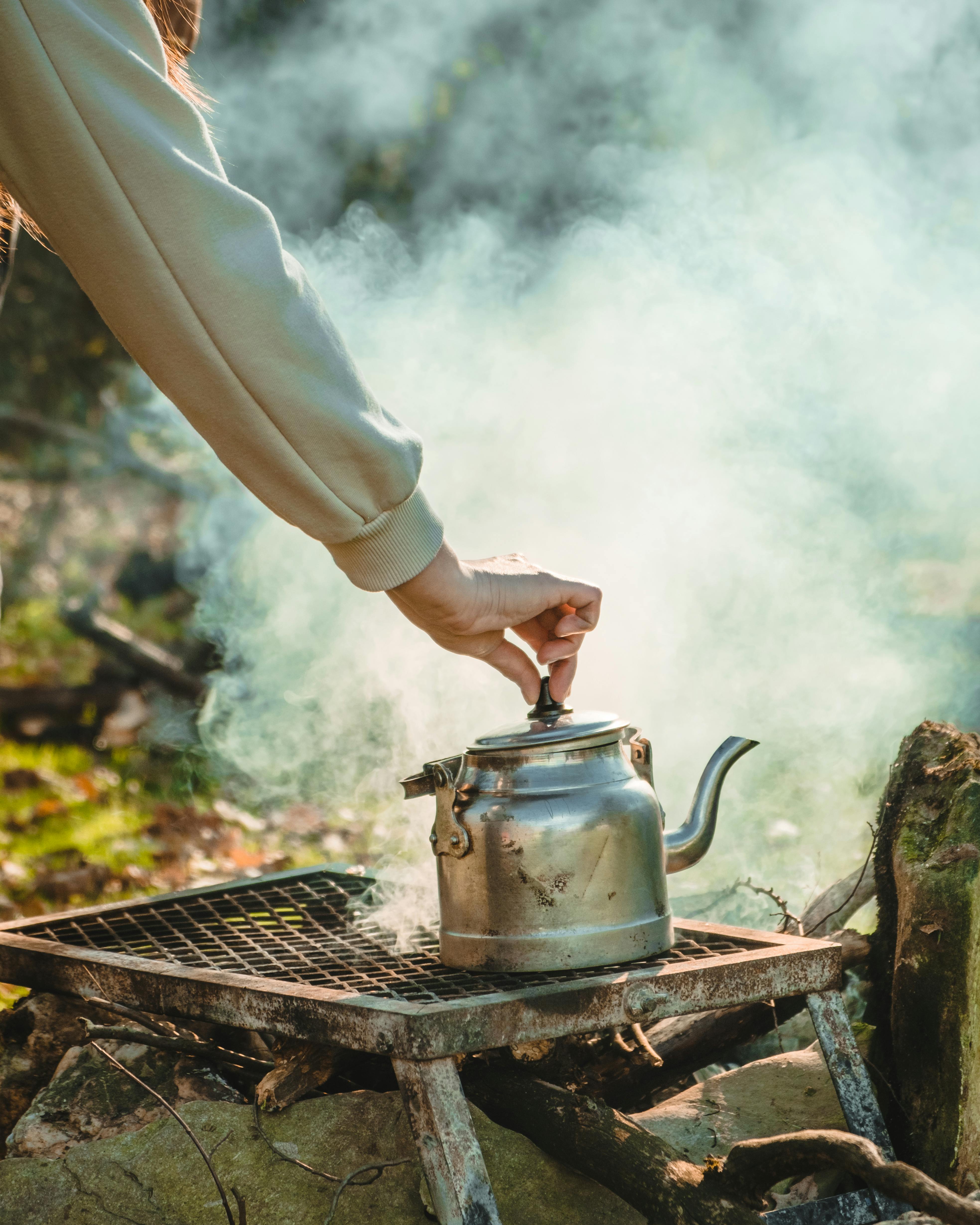 A Person Holding a Kettle · Free Stock Photo