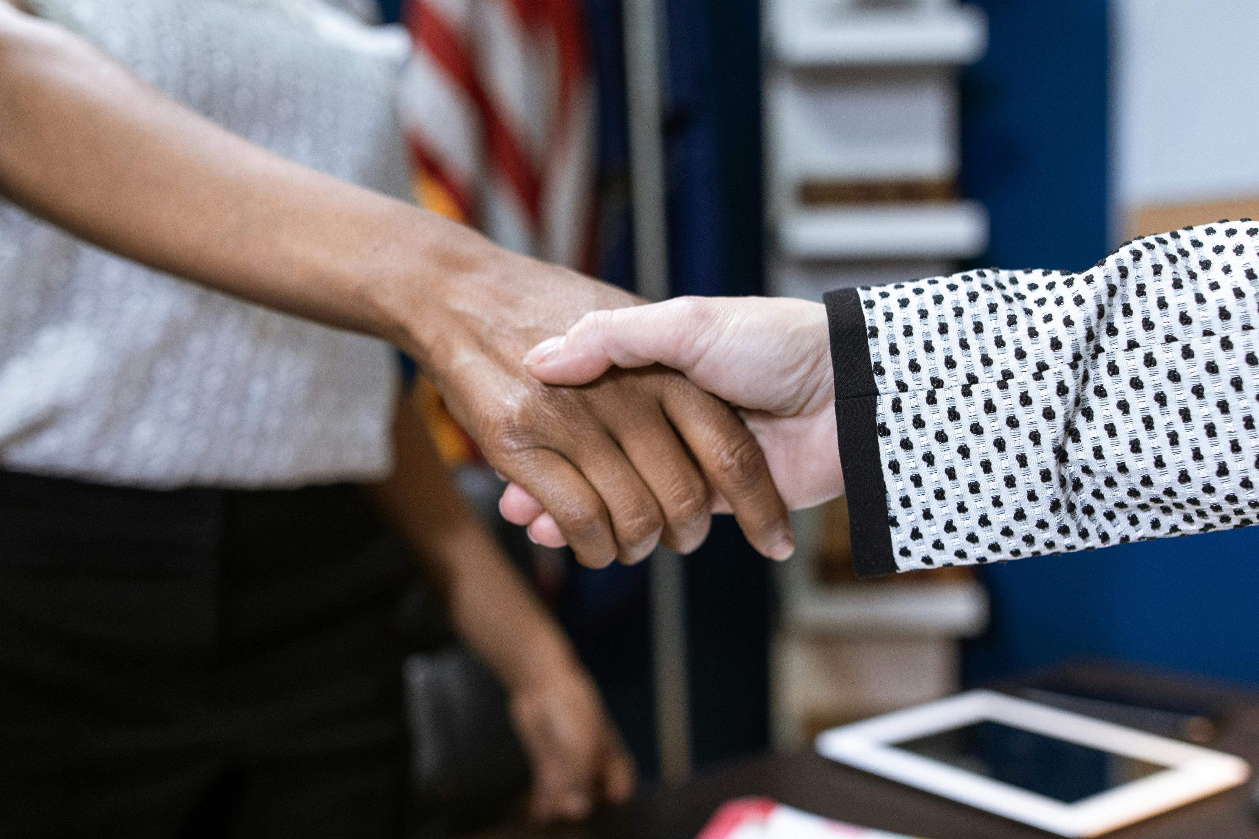 Two Person in Long-sleeved Shirt Shakehand · Free Stock Photo