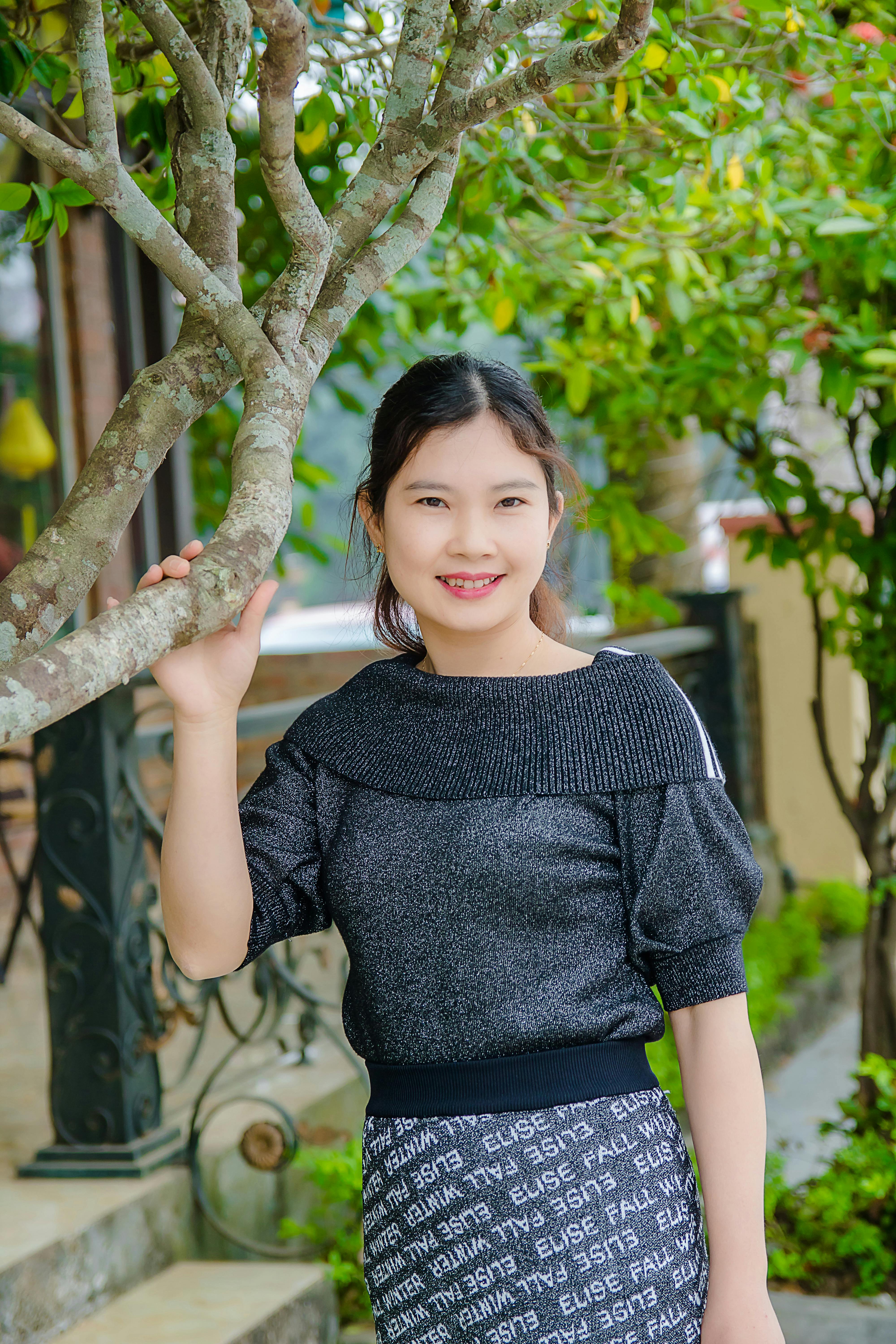 Beautiful Woman holding a Tree Branch · Free Stock Photo