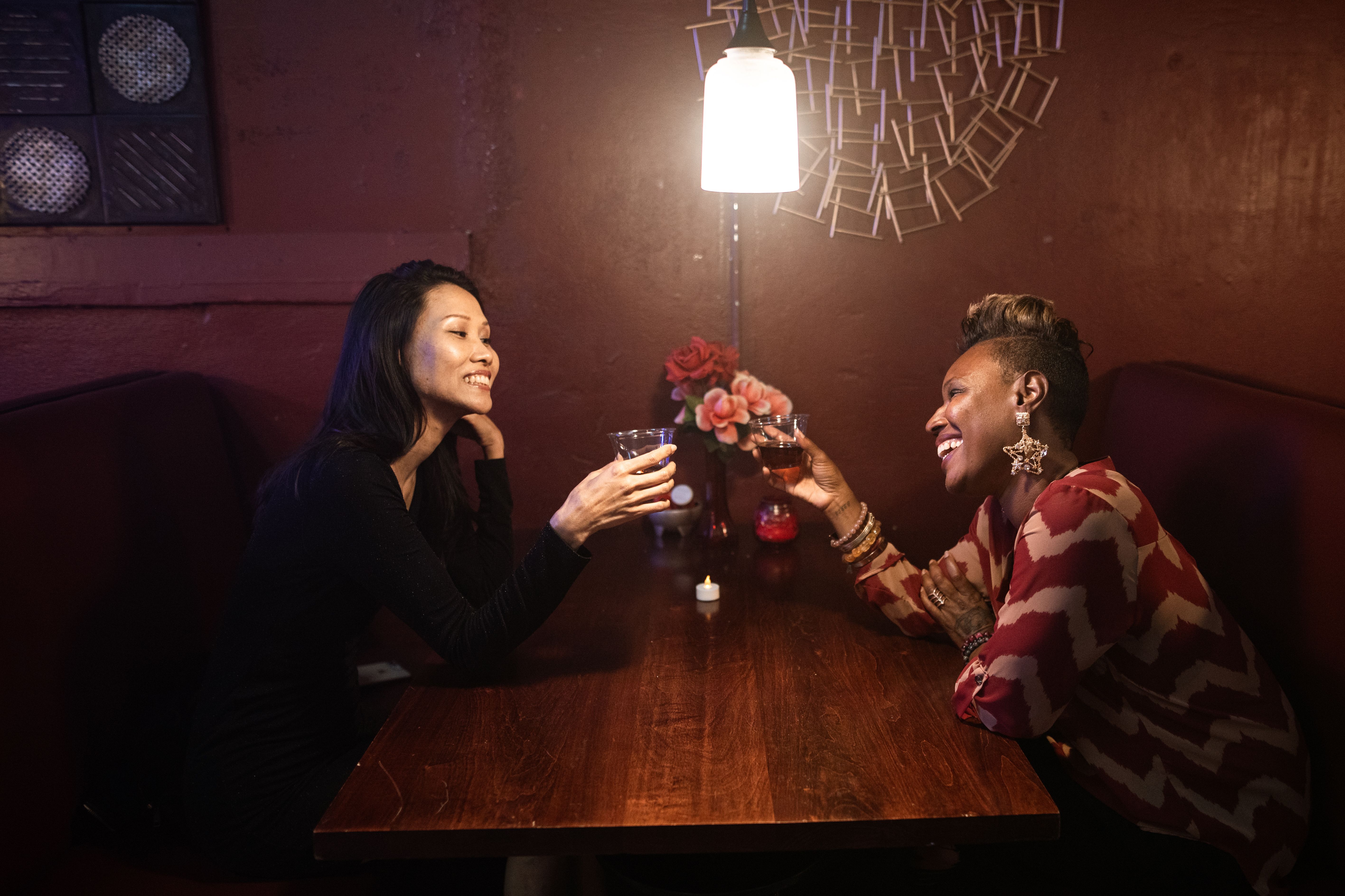 Two Women Talking while Drinking Together · Free Stock Photo