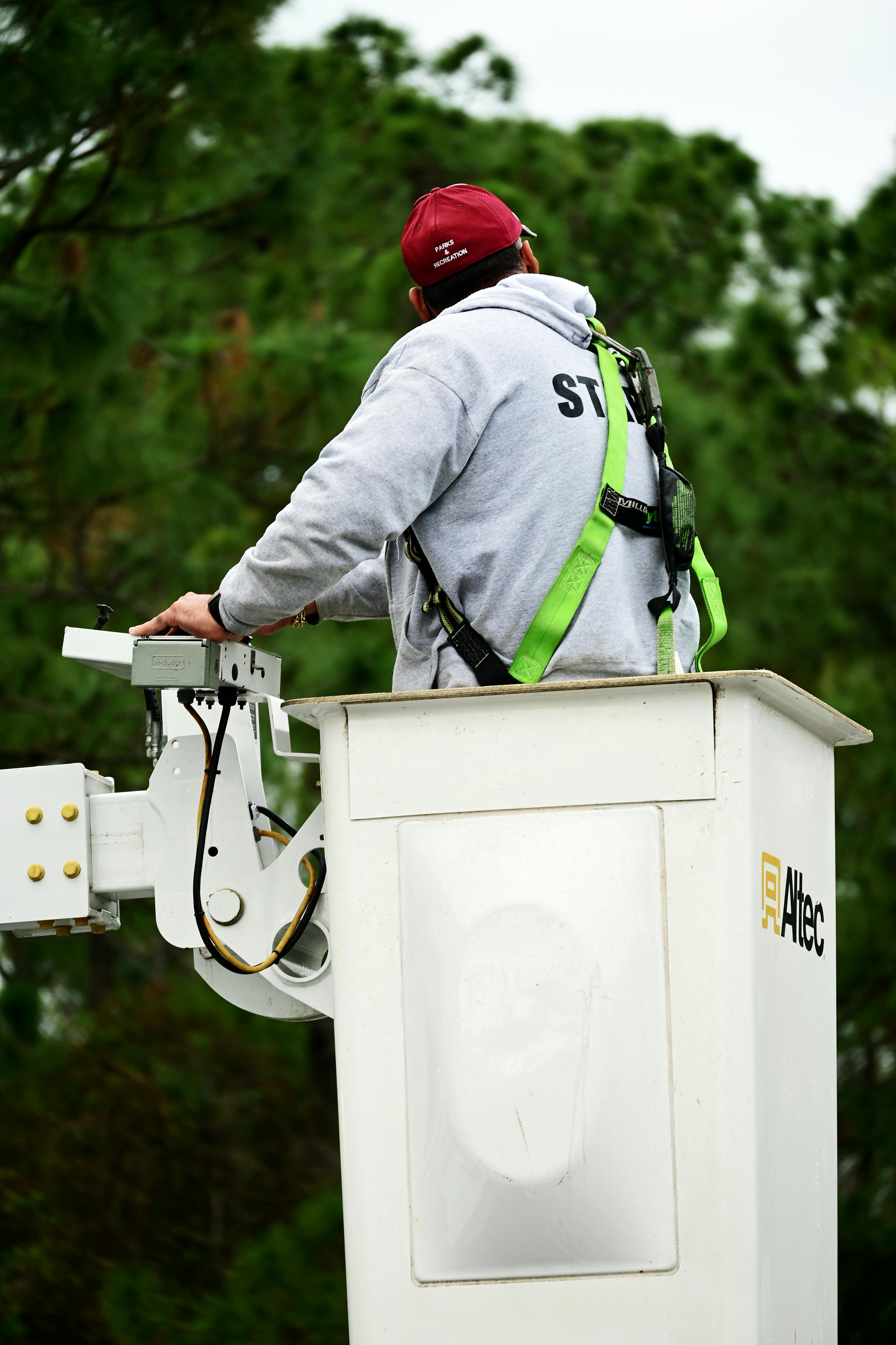Photo of a Worker on a Bucket Truck · Free Stock Photo