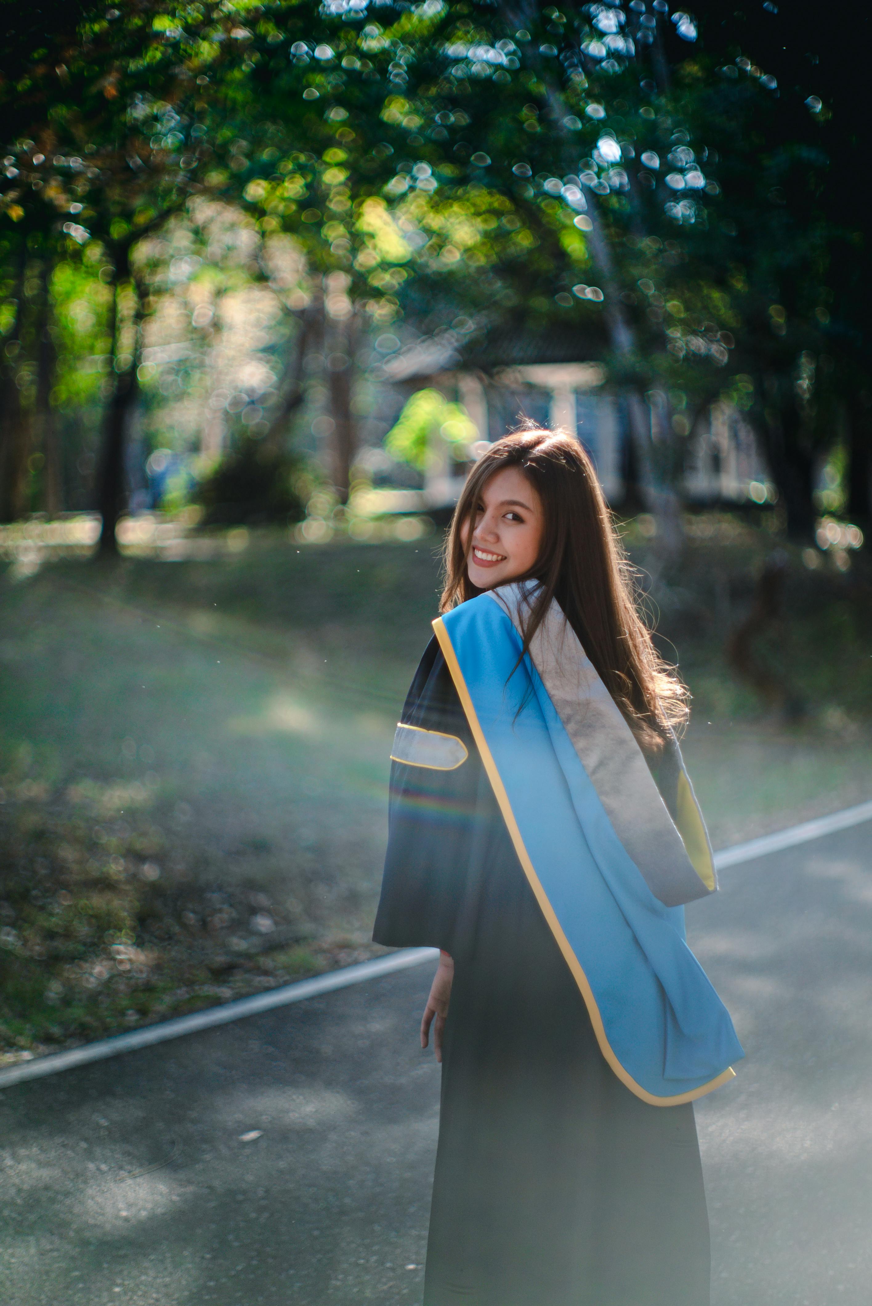 A Woman Wearing a Graduation Gown · Free Stock Photo