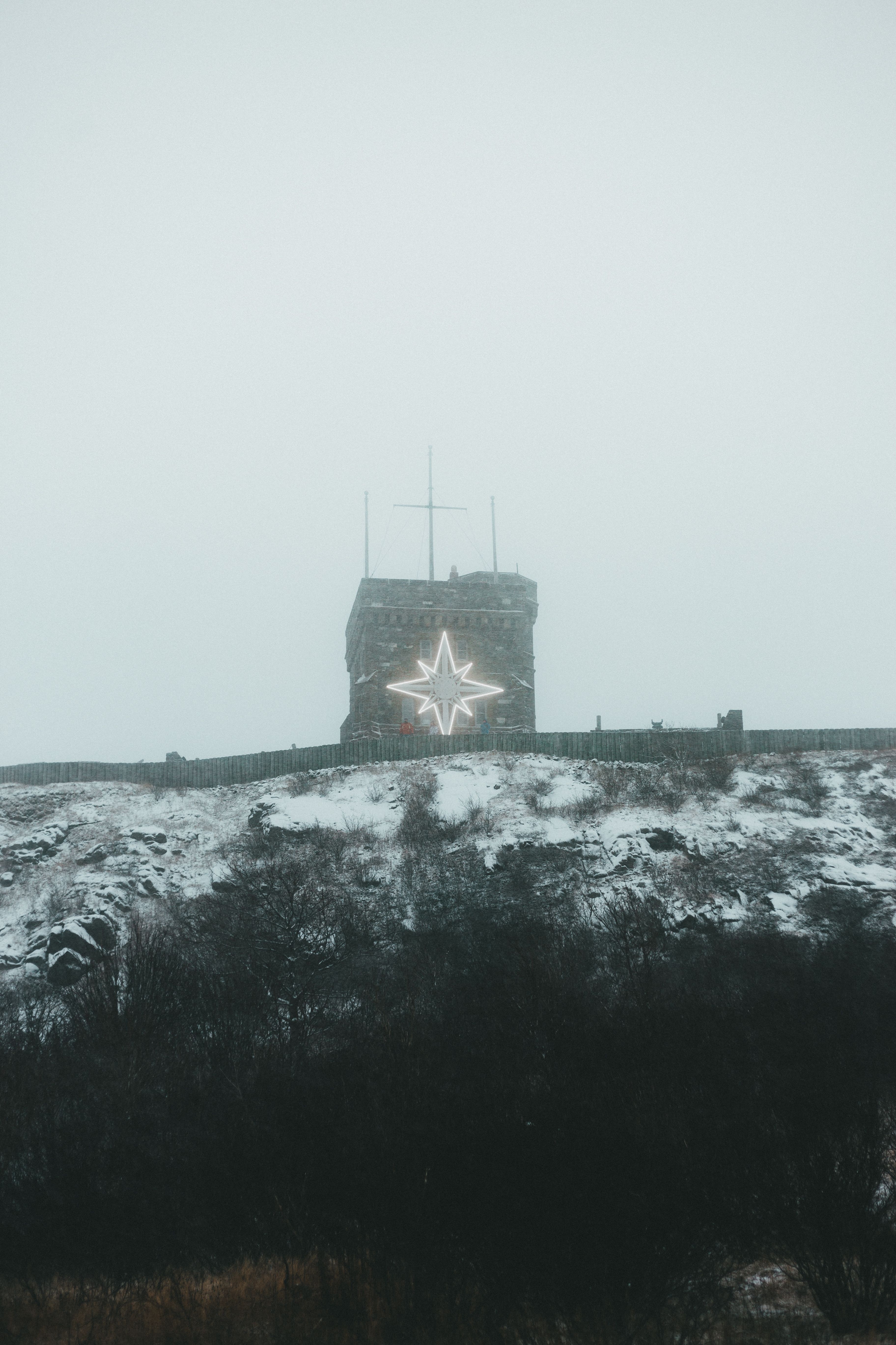 A Gray Concrete Building Covered With Snow · Free Stock Photo