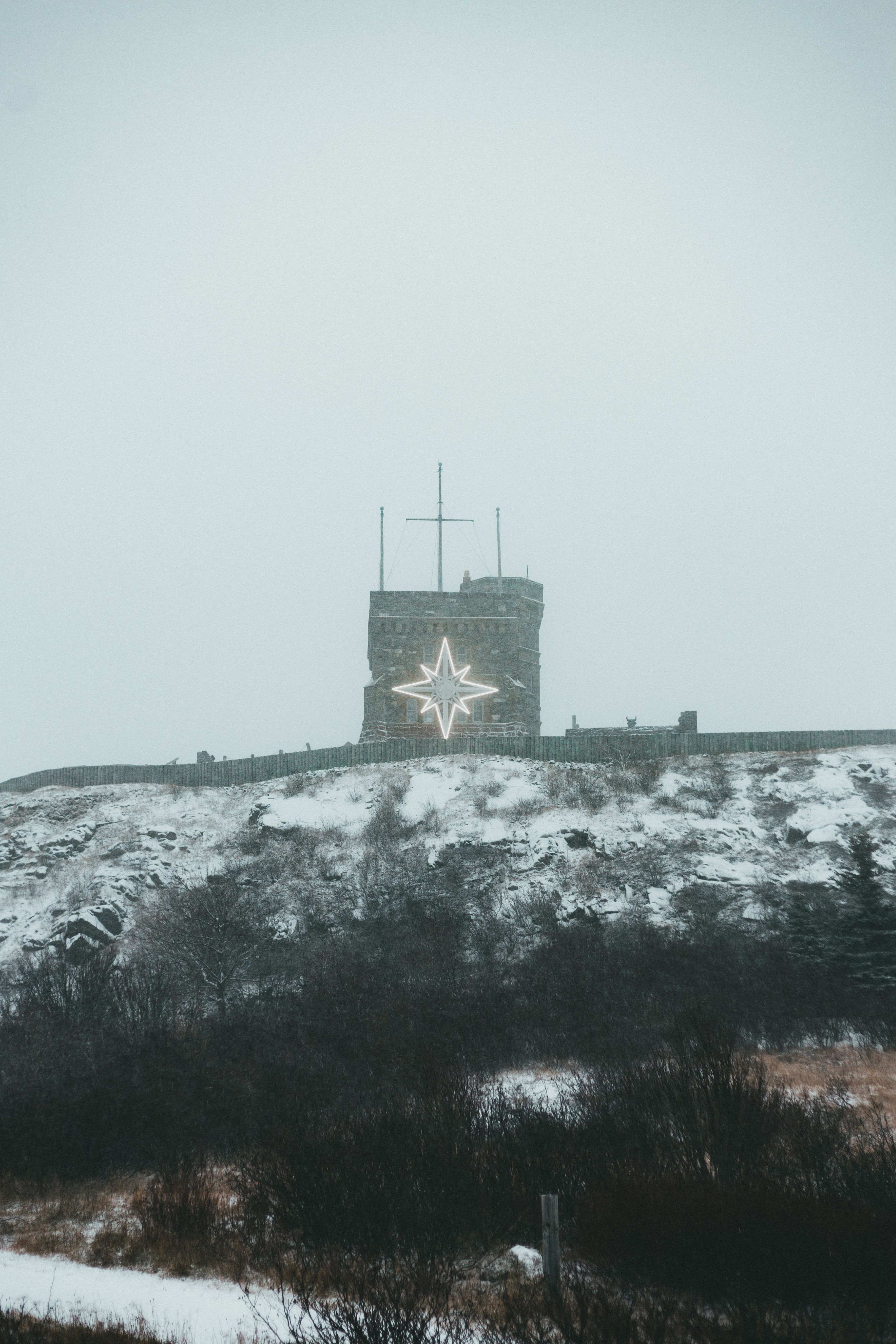 A Gray Concrete Building Covered With Snow · Free Stock Photo