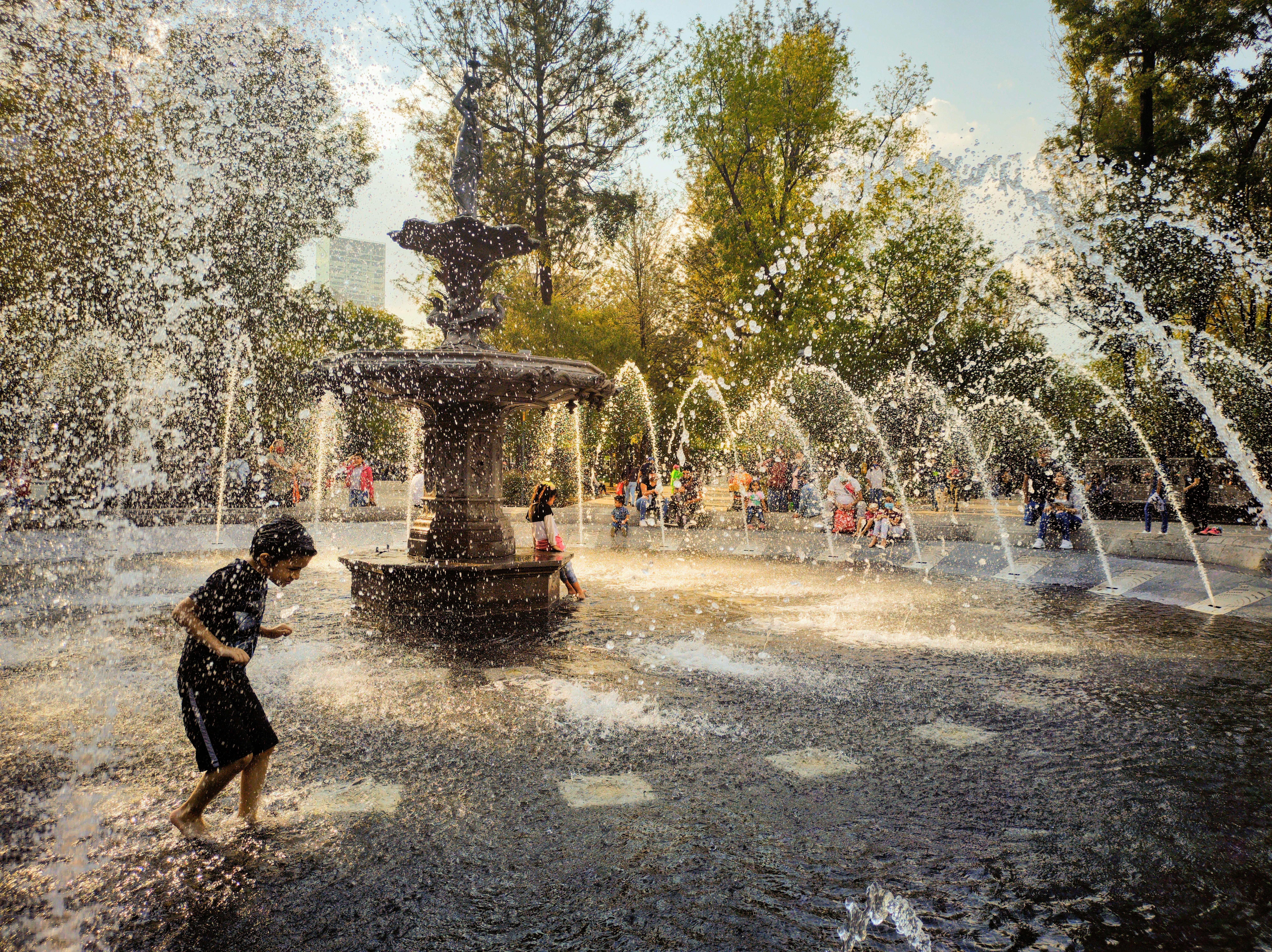 Kids Playing on the Water Fountain · Free Stock Photo