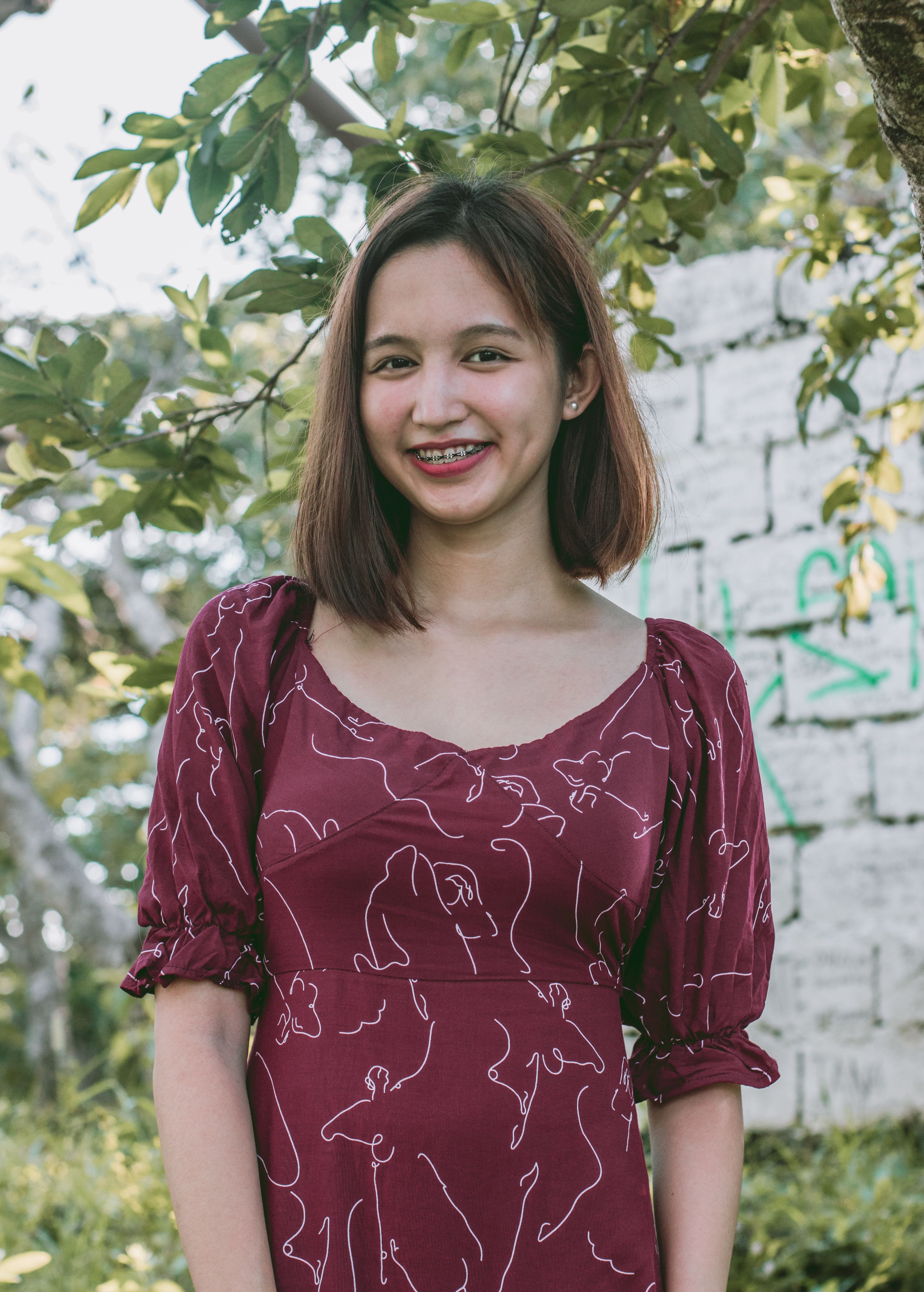 A Pretty Woman in Red Top Smiling · Free Stock Photo