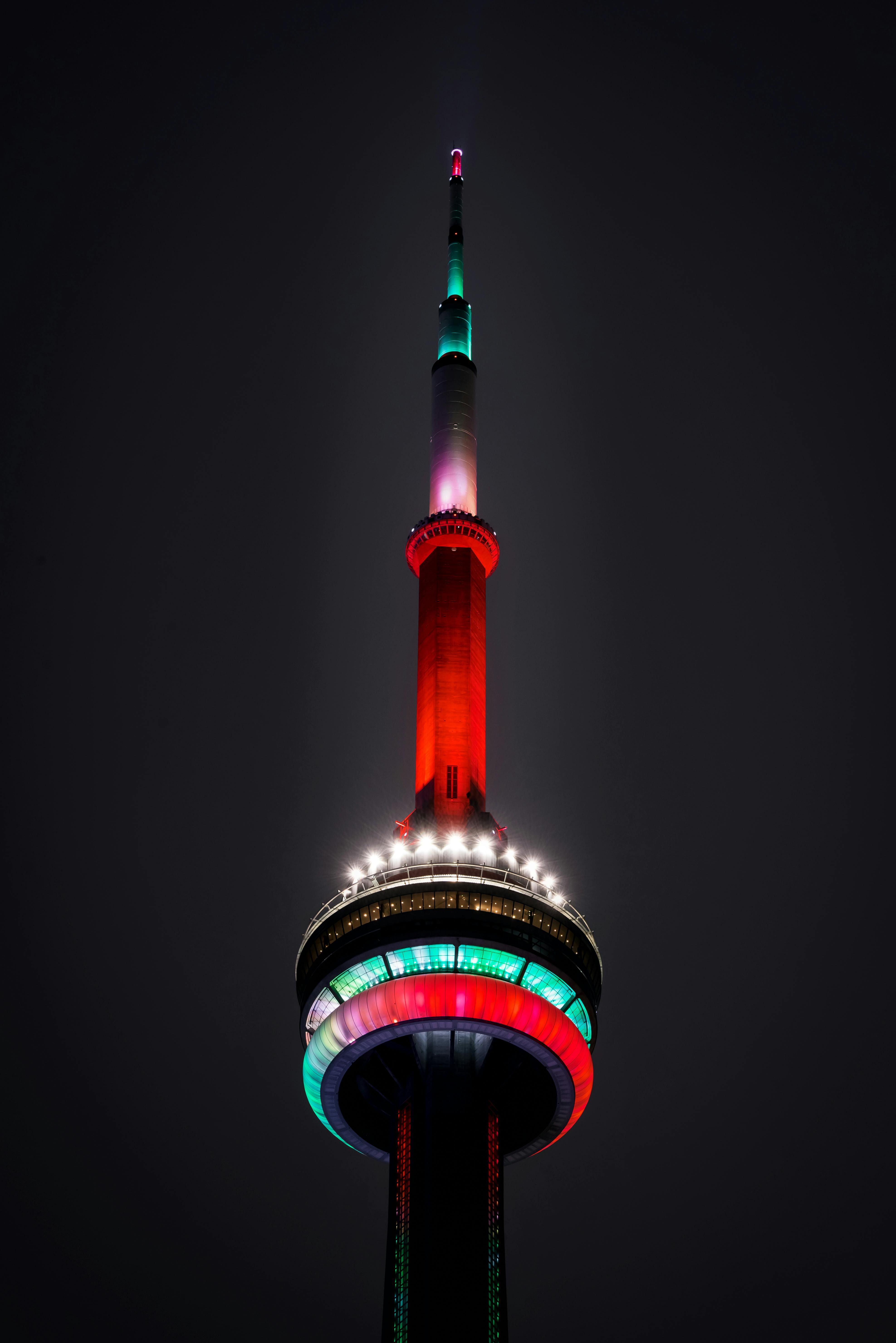 Modern illuminated tower on night sky · Free Stock Photo